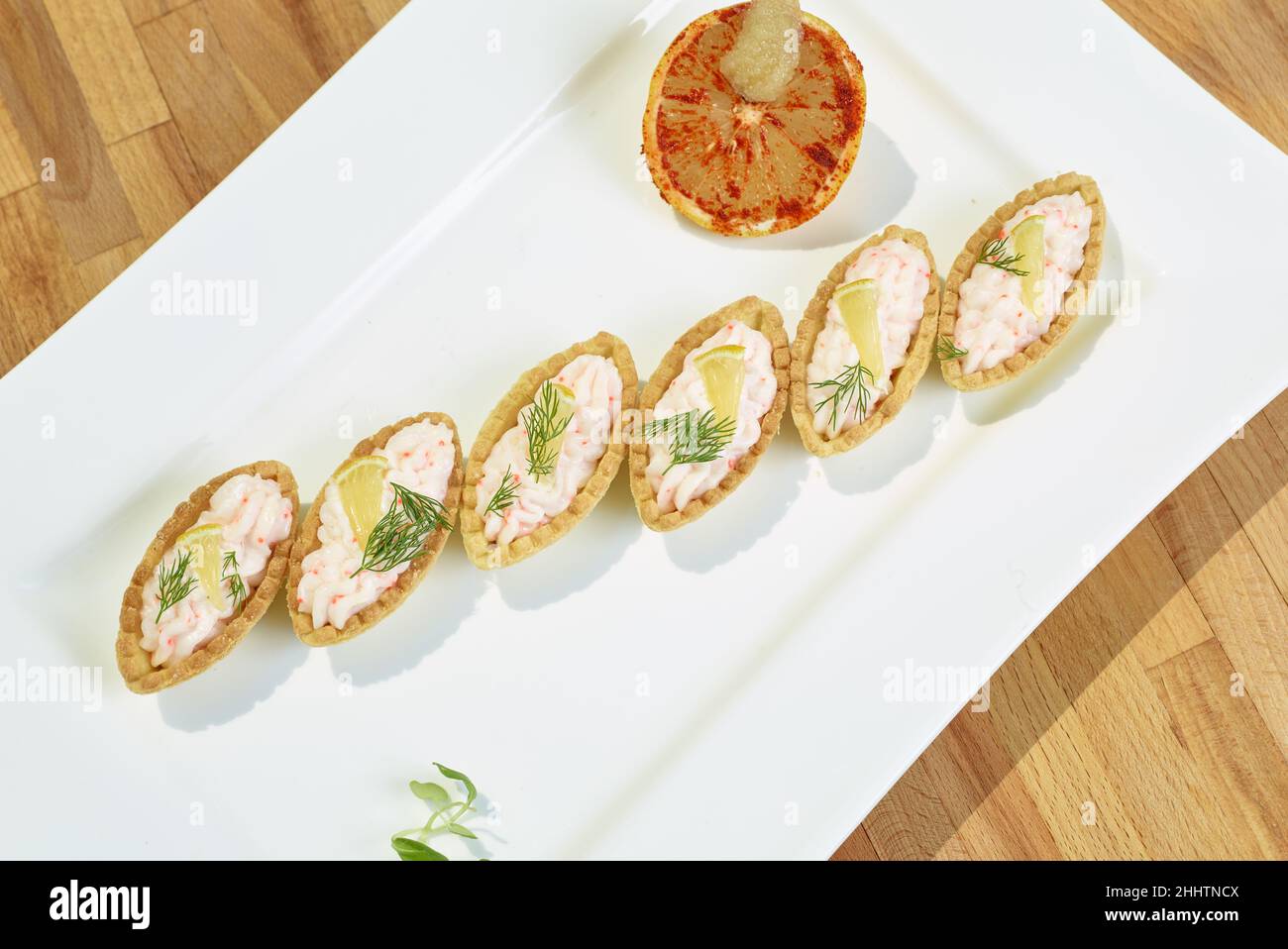 Salad of roe seasoned with tomato and lemon Stock Photo - Alamy
