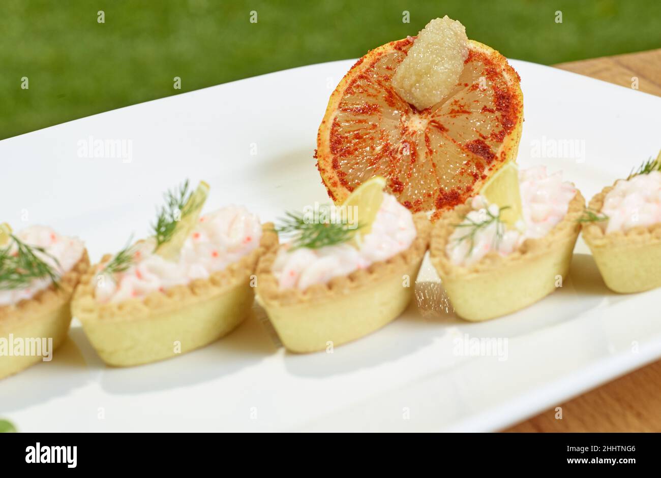 Salad of roe seasoned with tomato and lemon Stock Photo - Alamy