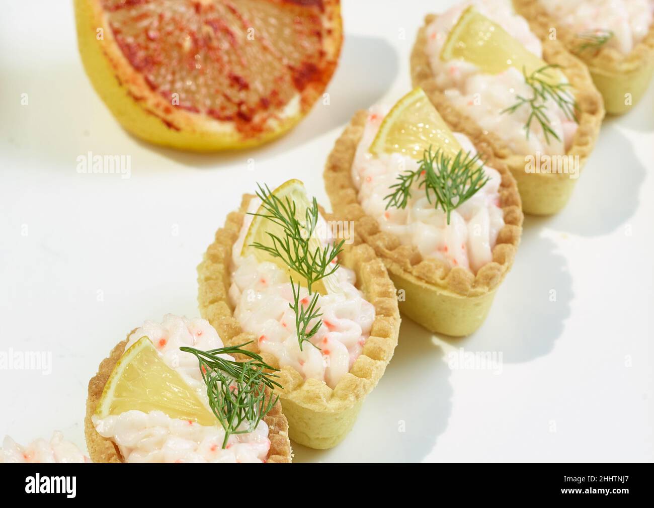 Salad of roe seasoned with tomato and lemon Stock Photo - Alamy