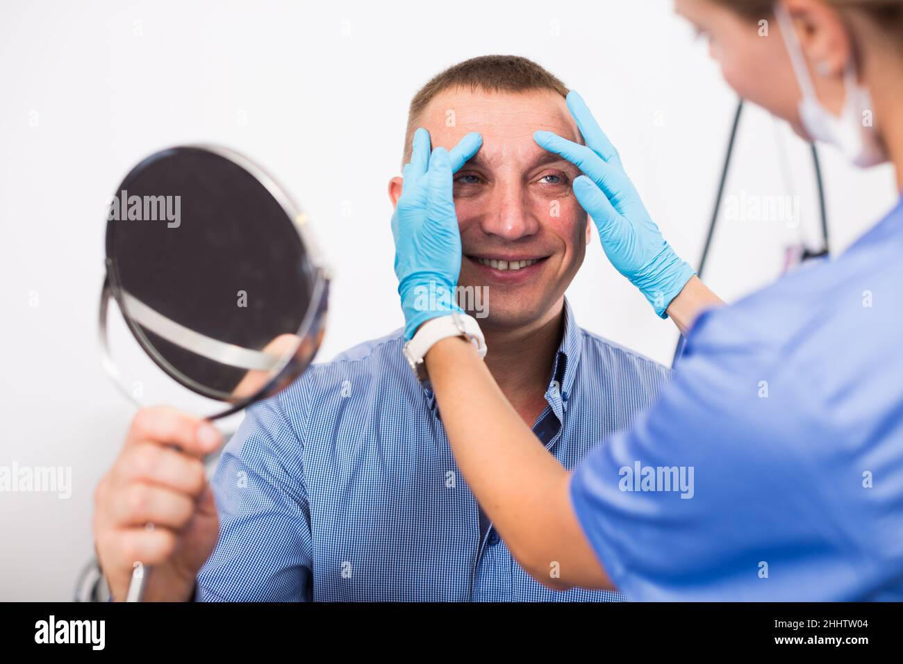 Female doctor is preparing client to procedure Stock Photo - Alamy