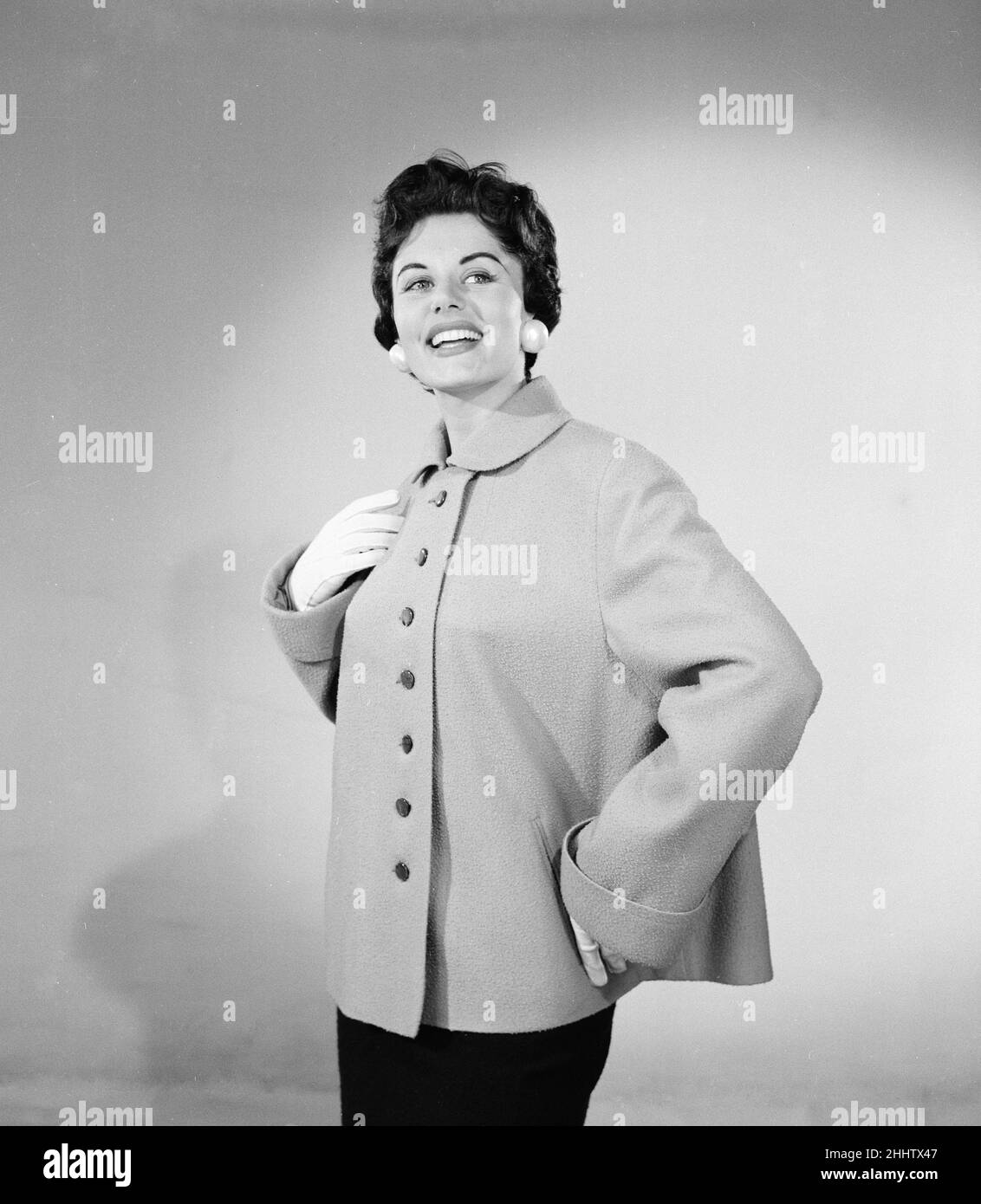 Eunice Gayson, actress and model, poses in a jacket for Sunday Mirror ...
