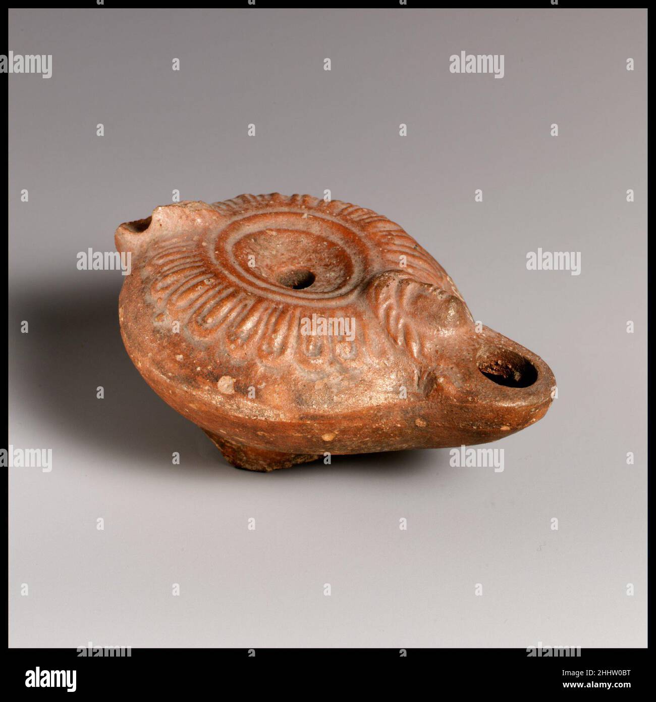 Terracotta oil lamp 2nd century A.D. Roman Mold-made, with ring handle ...