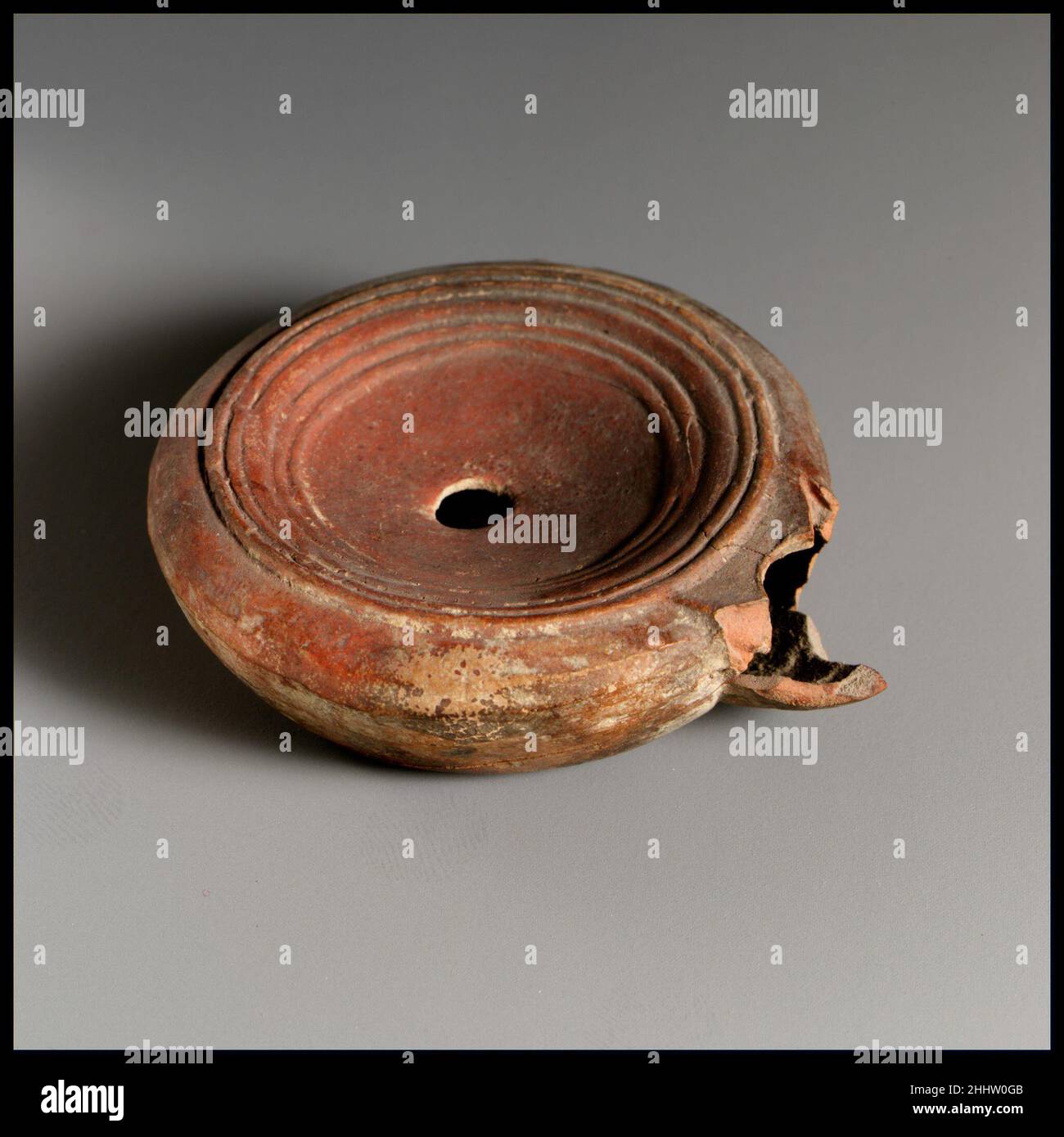 Terracotta oil lamp Roman, Cypriot Discus: plain with central filling ...