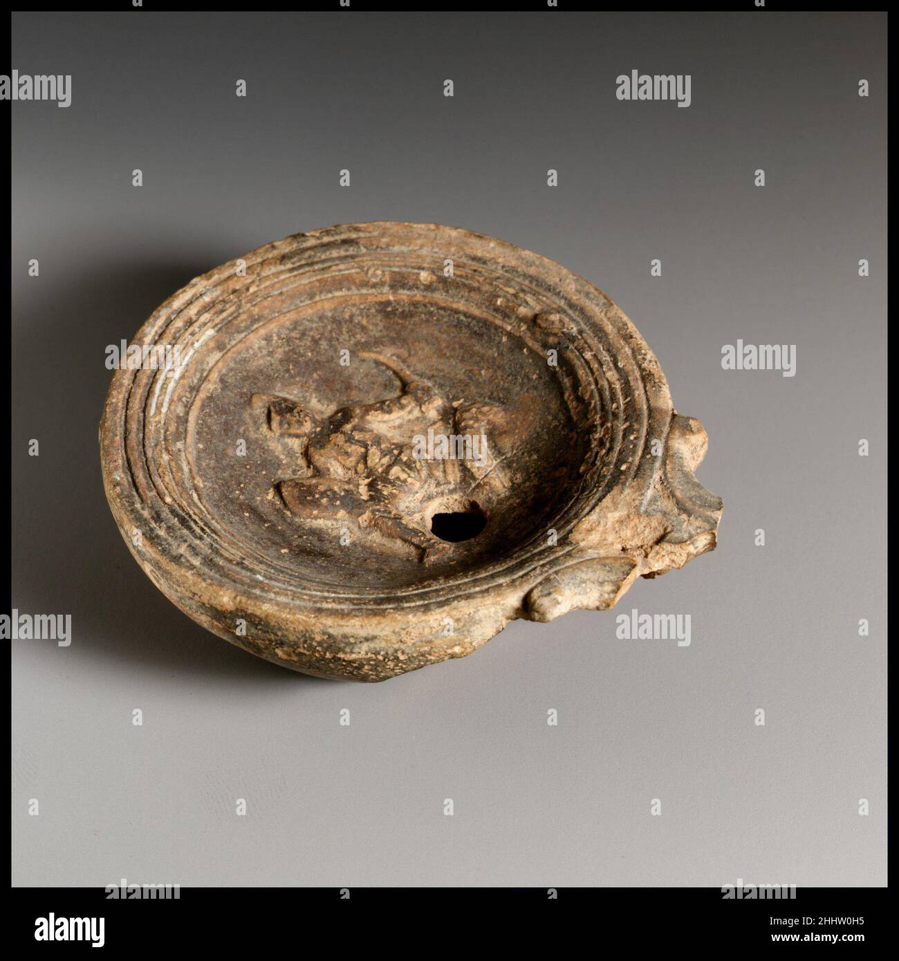 Terracotta oil lamp 1st century A.D. Roman, Cypriot Discus: gladiator ...