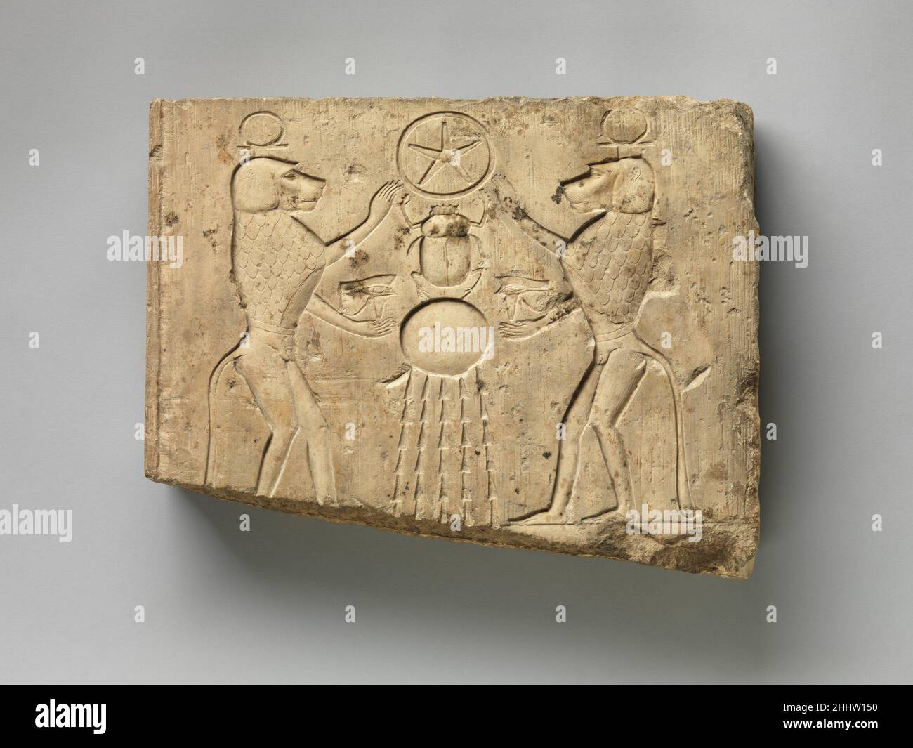 Relief panel showing two baboons offering the wedjat eye to the sun god ...