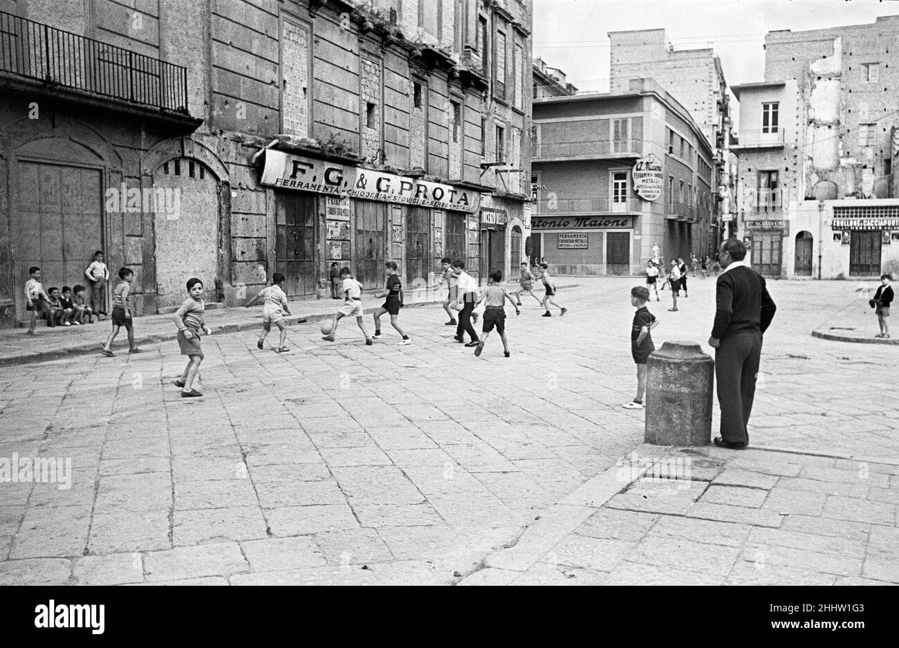 Scenes in Naples, southern Italy showing young boys enjoying a game of ...