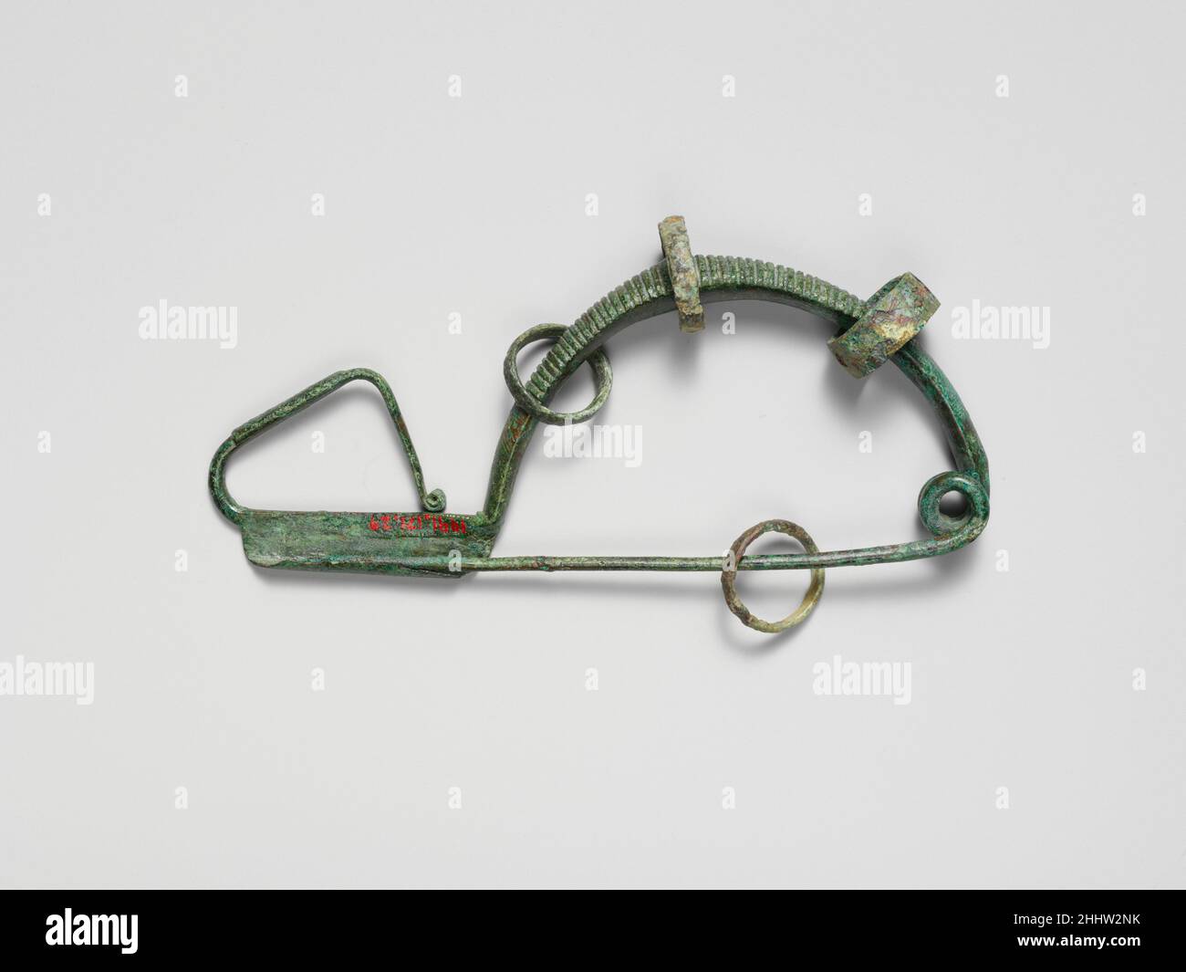 Bronze fibula (safety pin) with four rings 9th century B.C. Italic With ...