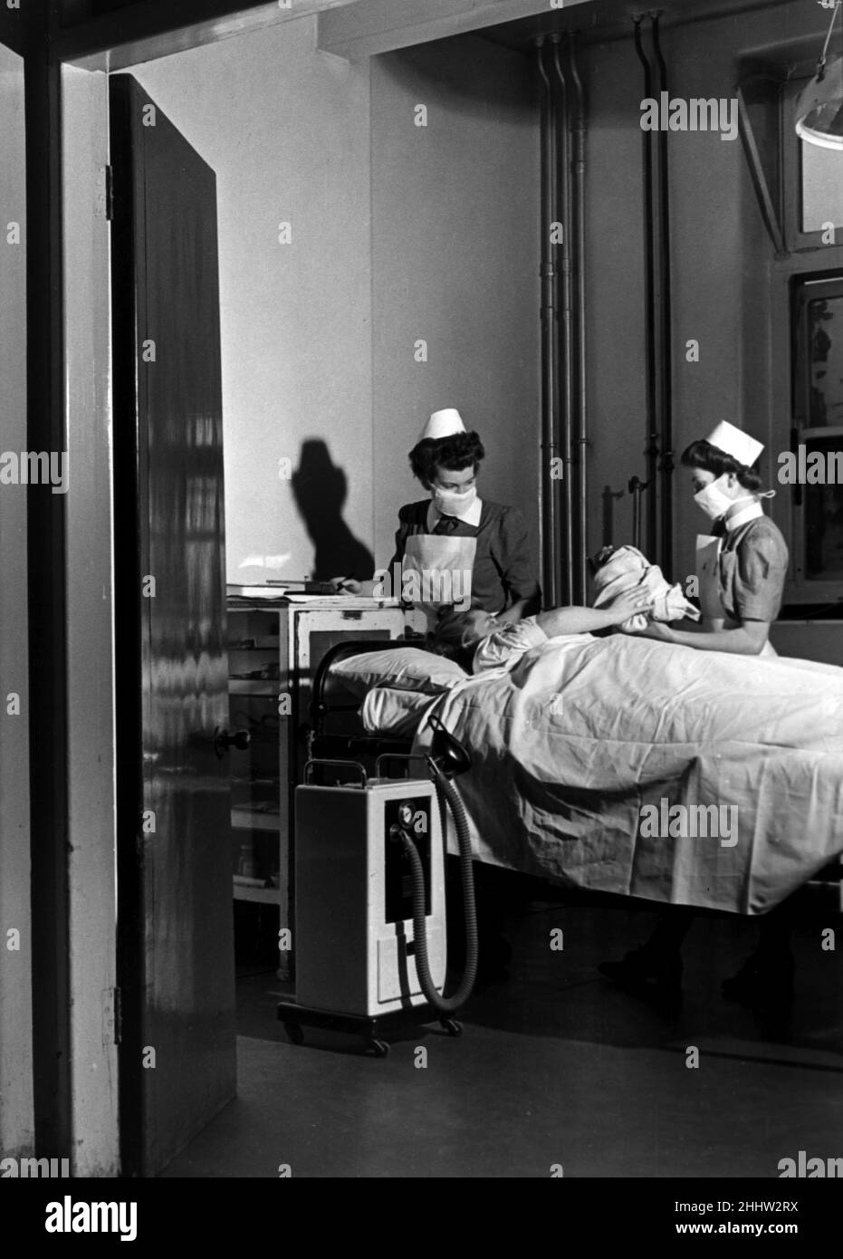 Midwives deliver a new born baby inside thew Labour ward at the British ...