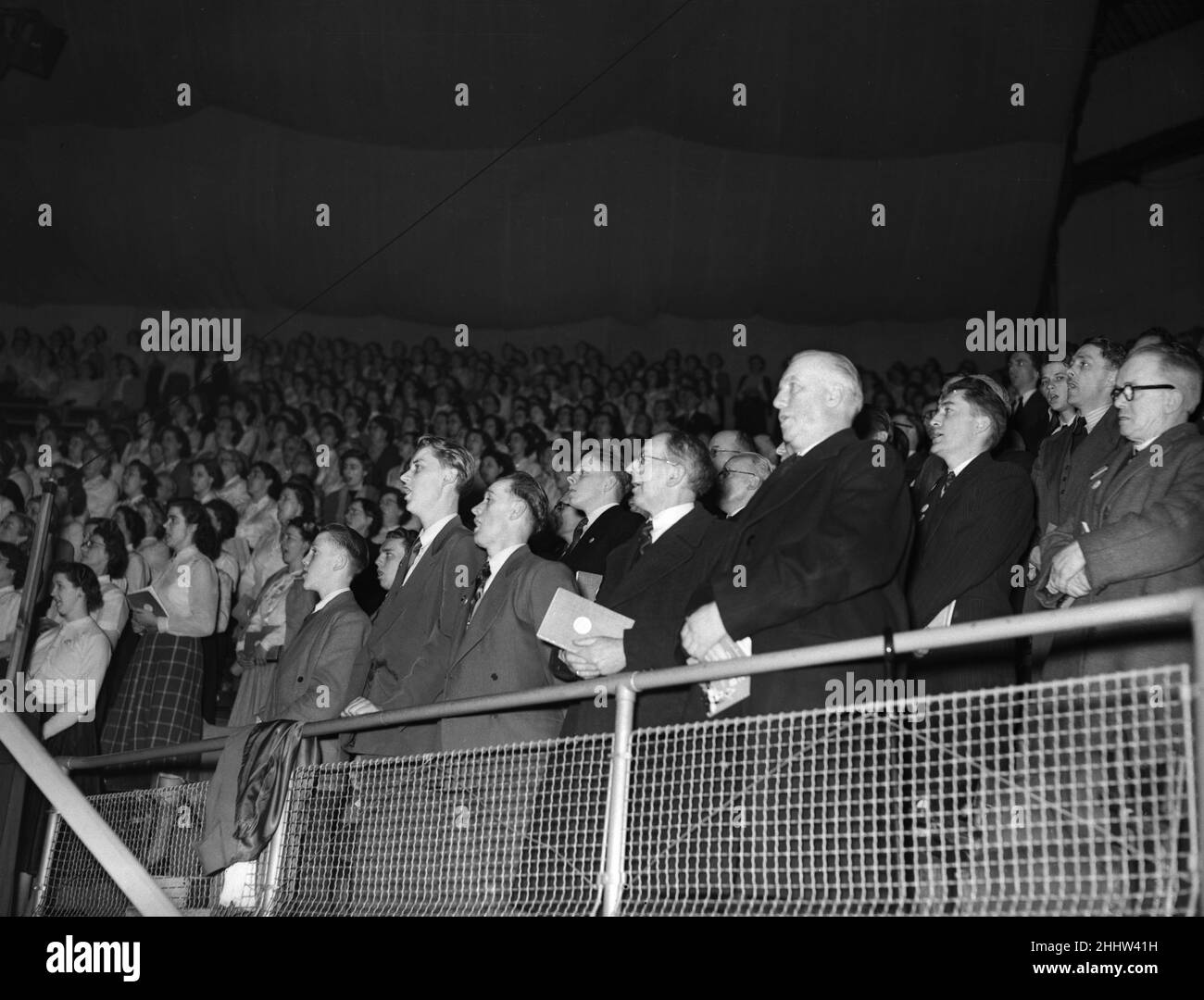 American evangelist Billy Graham speaks to the crowd at the Harringay ...