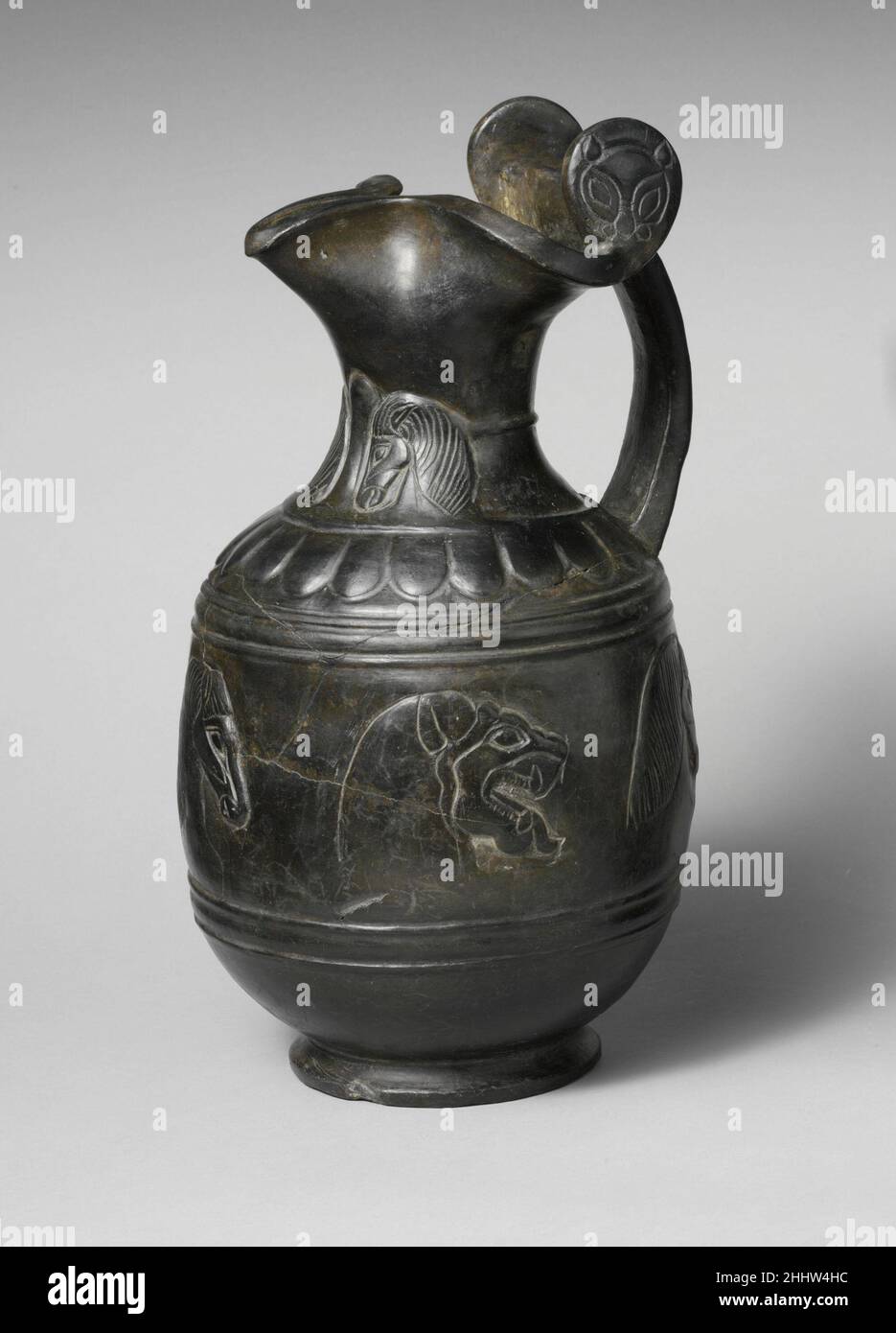 Terracotta trefoil oinochoe (jug) ca. 550 B.C. Etruscan Horse and lion ...