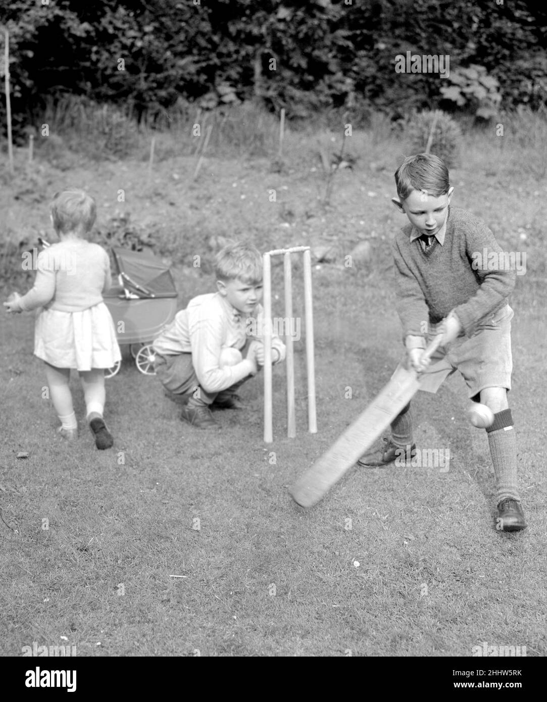 Girl playing cricket with boys hi-res stock photography and images - Alamy