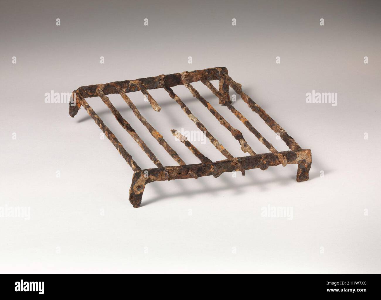 Iron fire-grate ca. 550 B.C. Etruscan On four feet and with eight ...