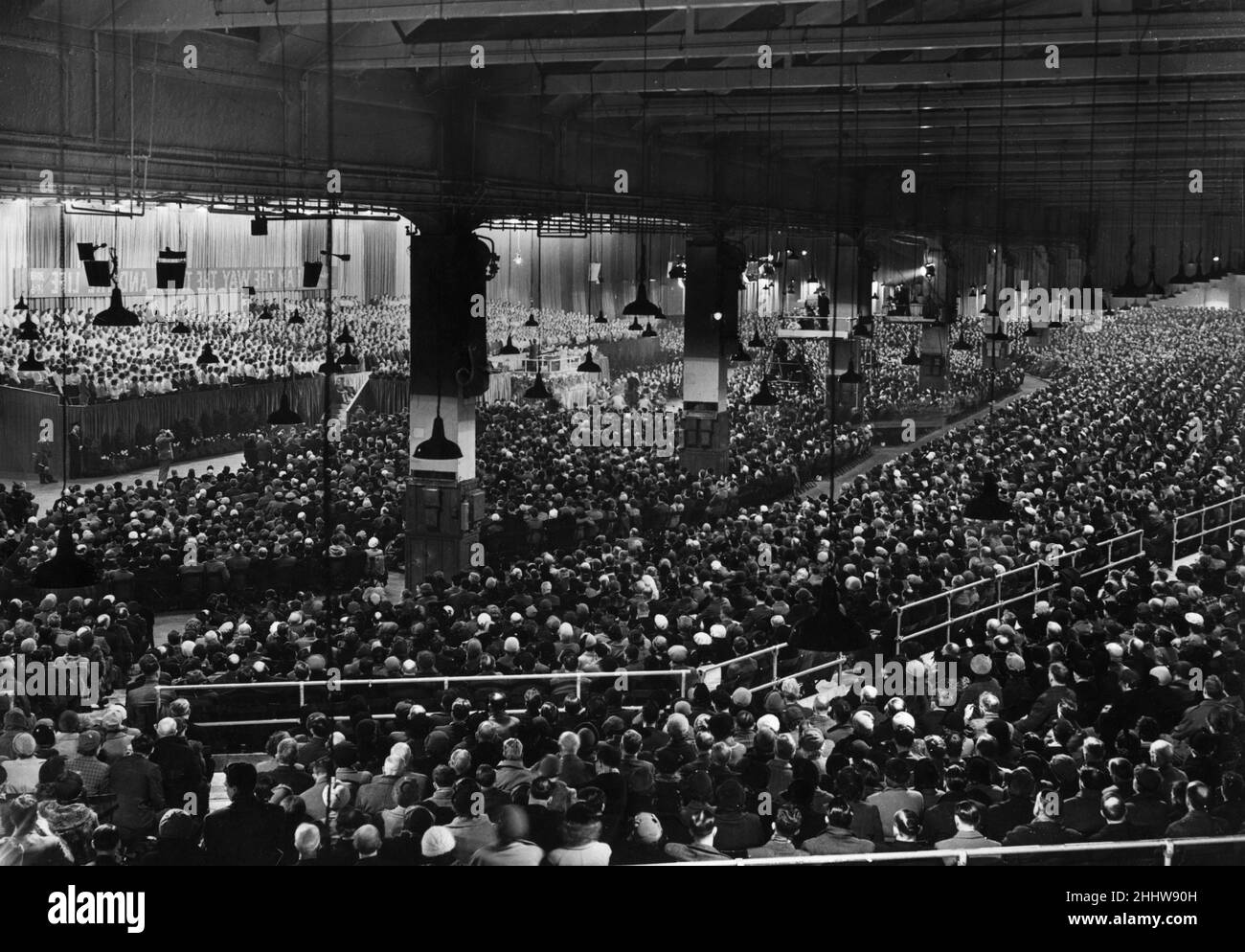 American evangelist Billy Graham addressing a huge crowd of people at ...
