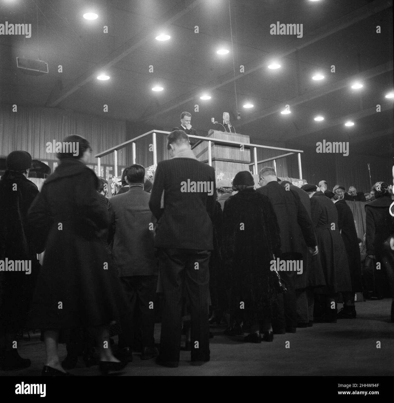 American evangelist Billy Graham addressing a huge crowd of people at ...