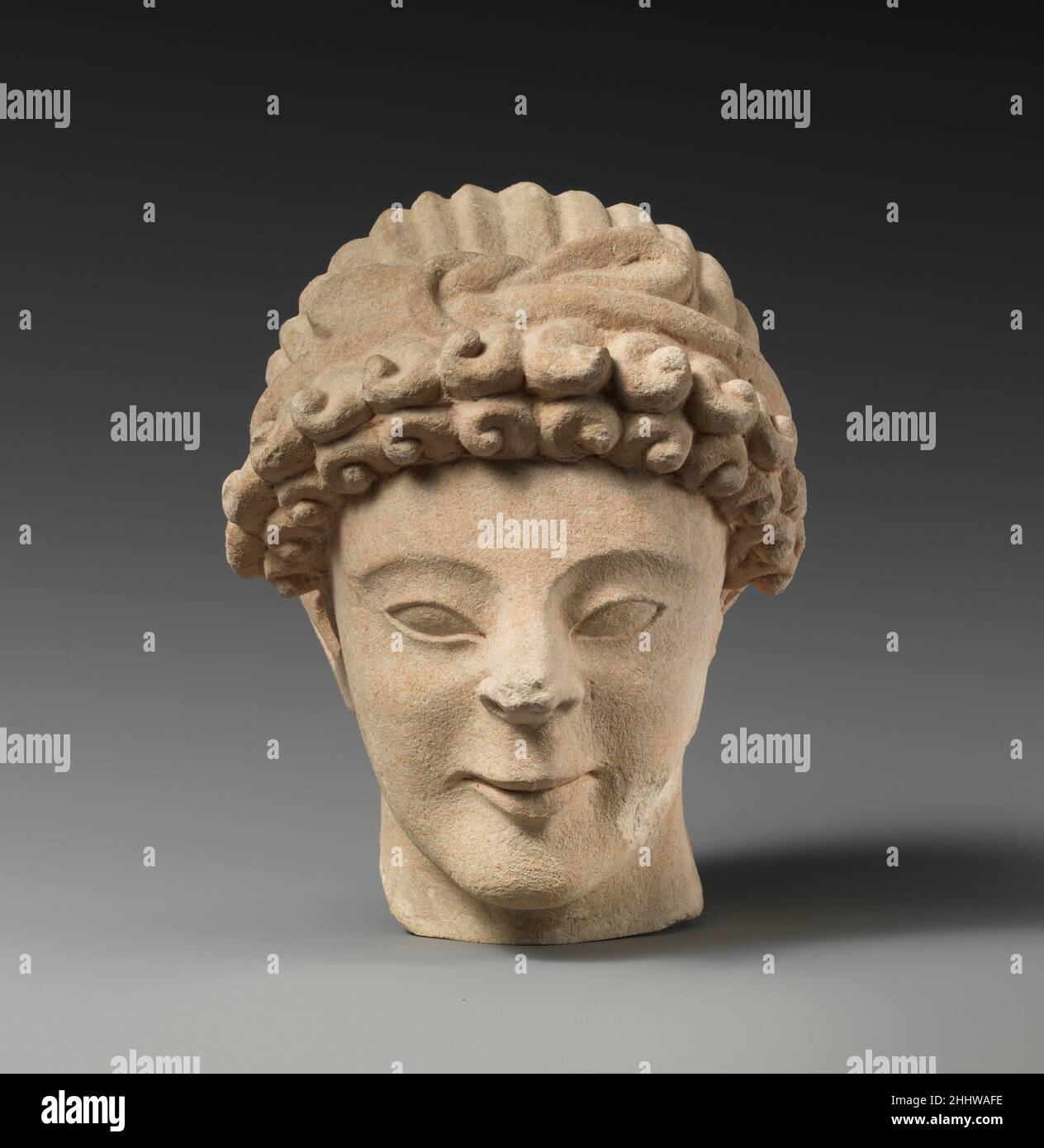 Limestone head of male votary with fillet late 6th or early 5th century ...