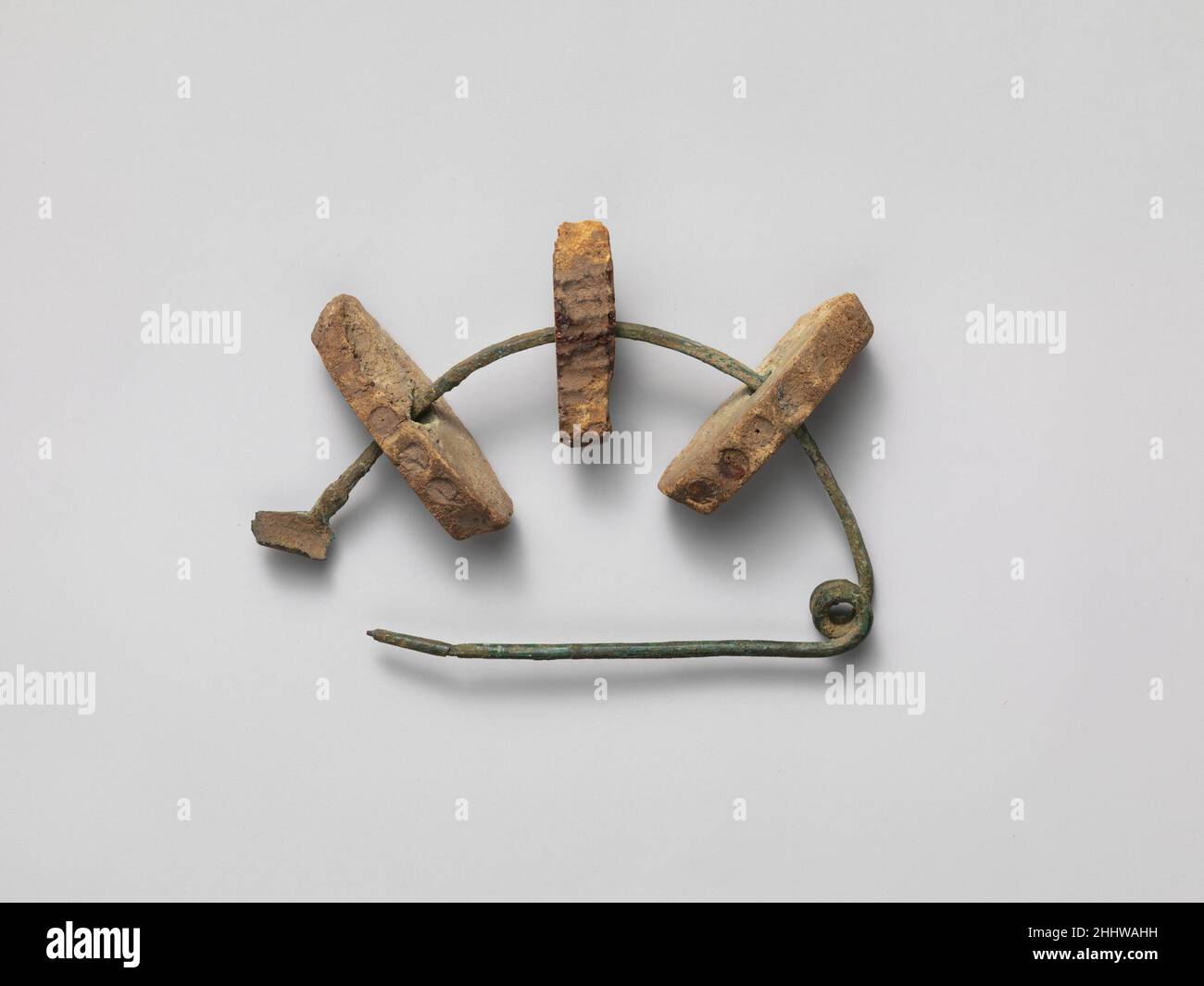 Bronze fibula (safety pin) with amber segments 7th–6th century B.C ...