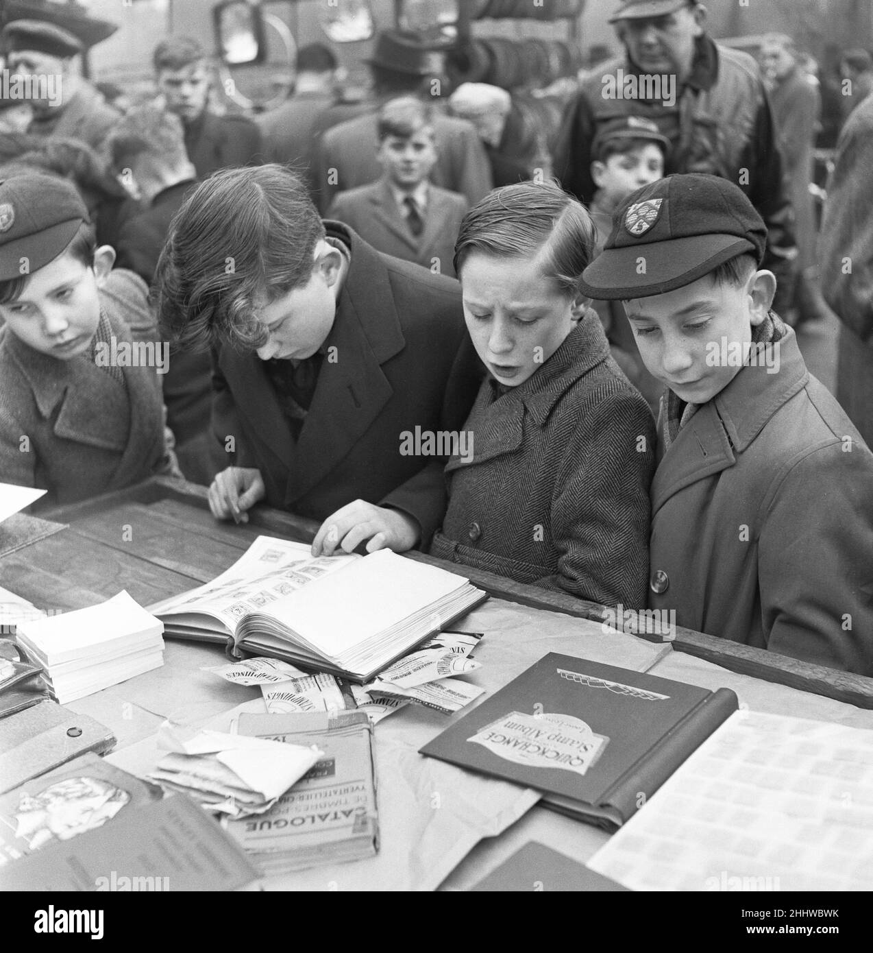 Young stamp collector looking to add to his collection at the flea ...