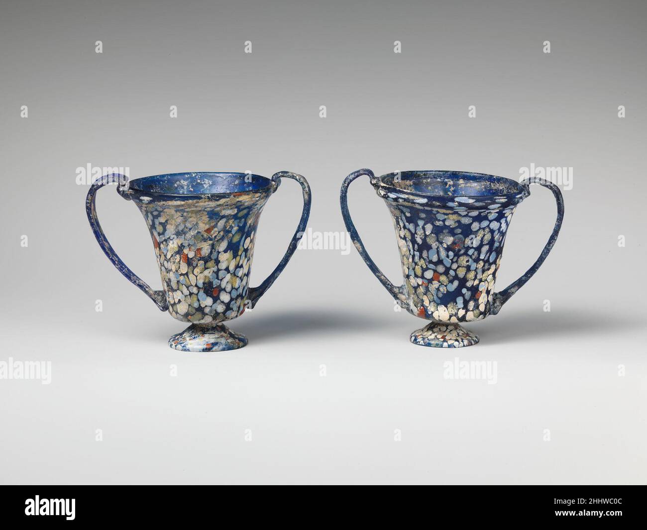 A pair of glass drinking cups 1st century A.D. Roman Translucent cobalt ...