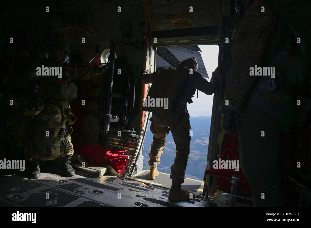 A jumpmaster from the 353rd Special Operations Group inspects a ...