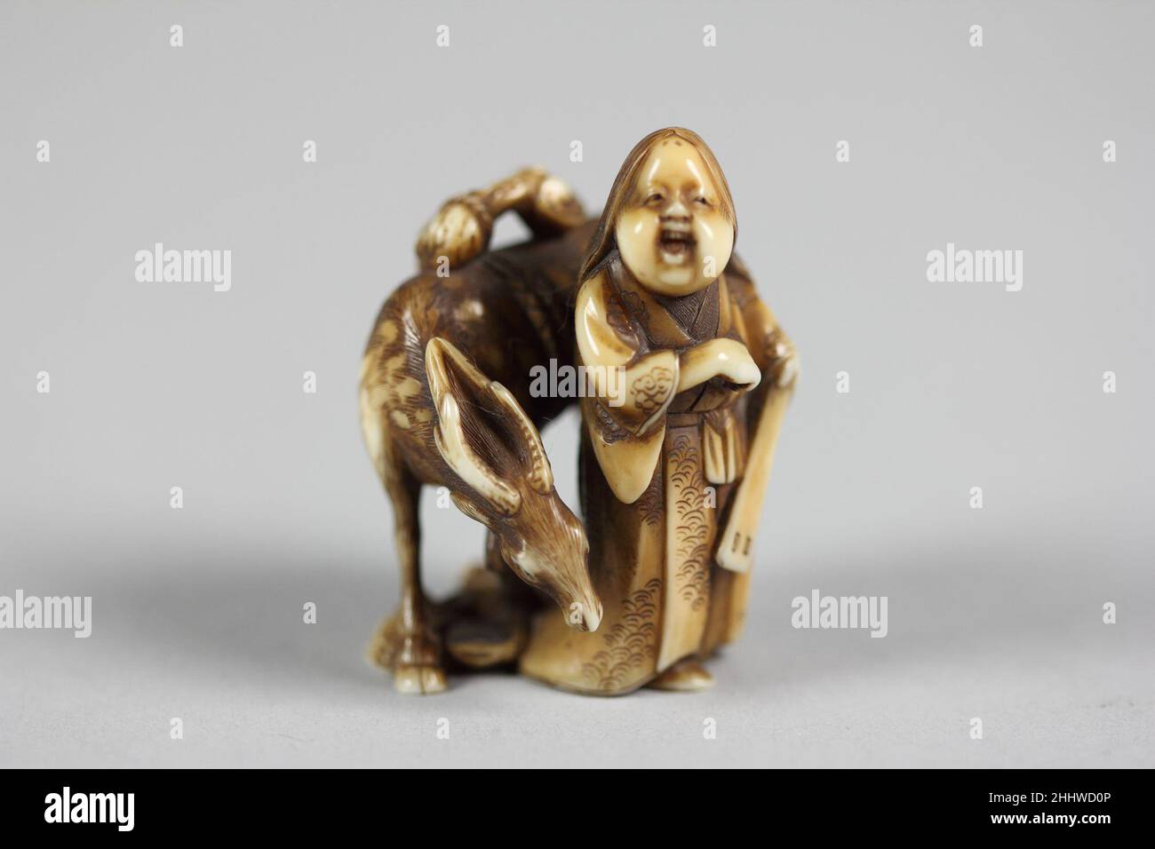 Netsuke of Female Figure (Okame) with a Deer late 18th century Japan ...