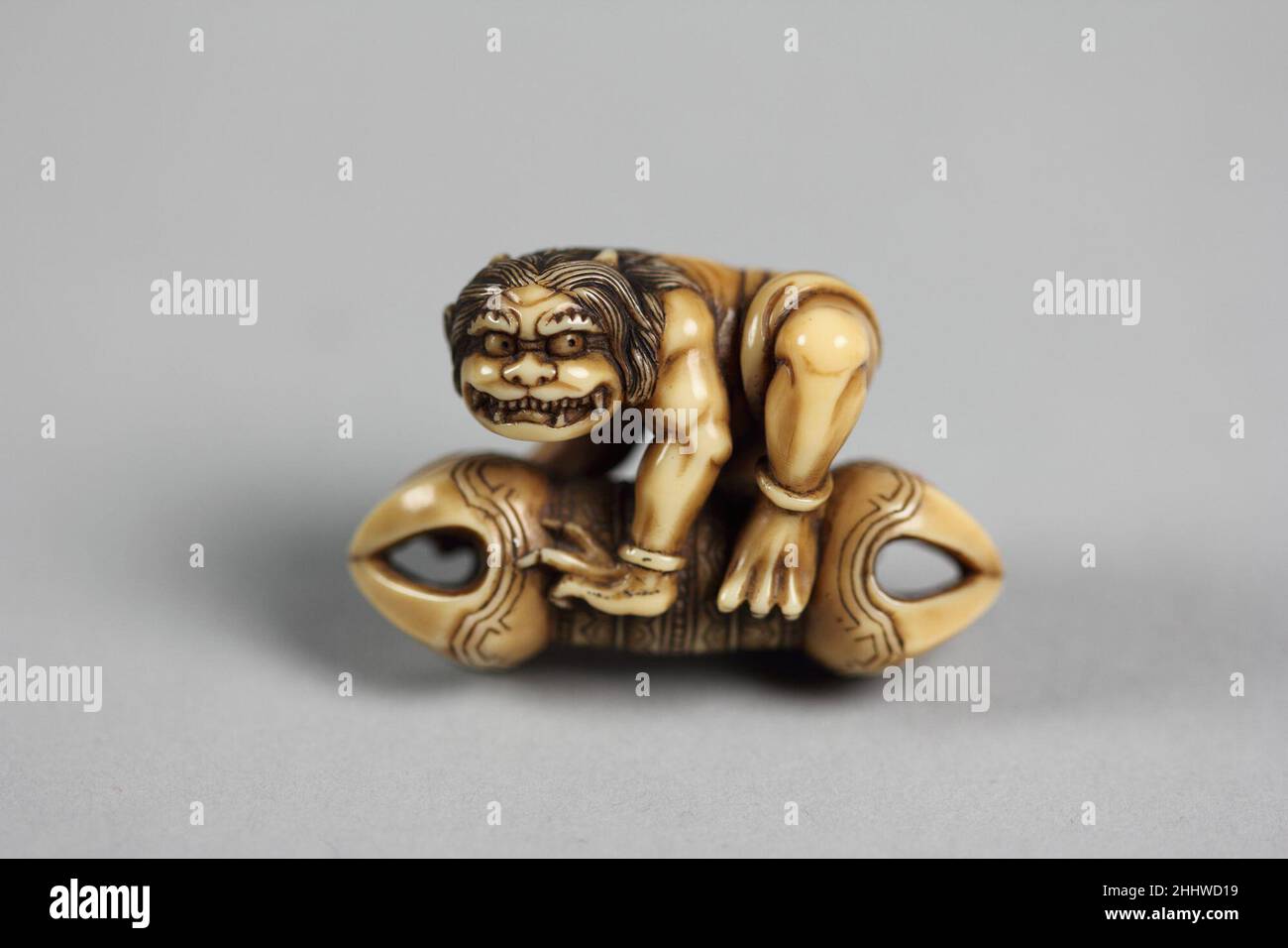 Netsuke of ?ni on Vadra, Crouching 19th century Japan. Netsuke of ?ni ...