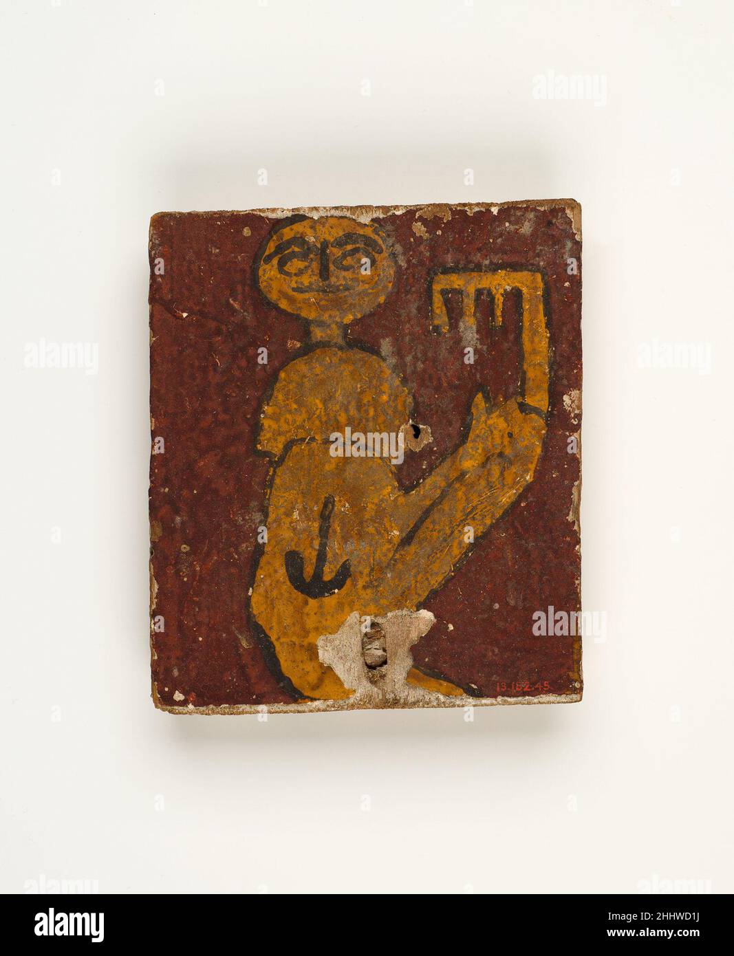 Panel with crouching figure holding a key 100–300 Roman Period. Panel ...