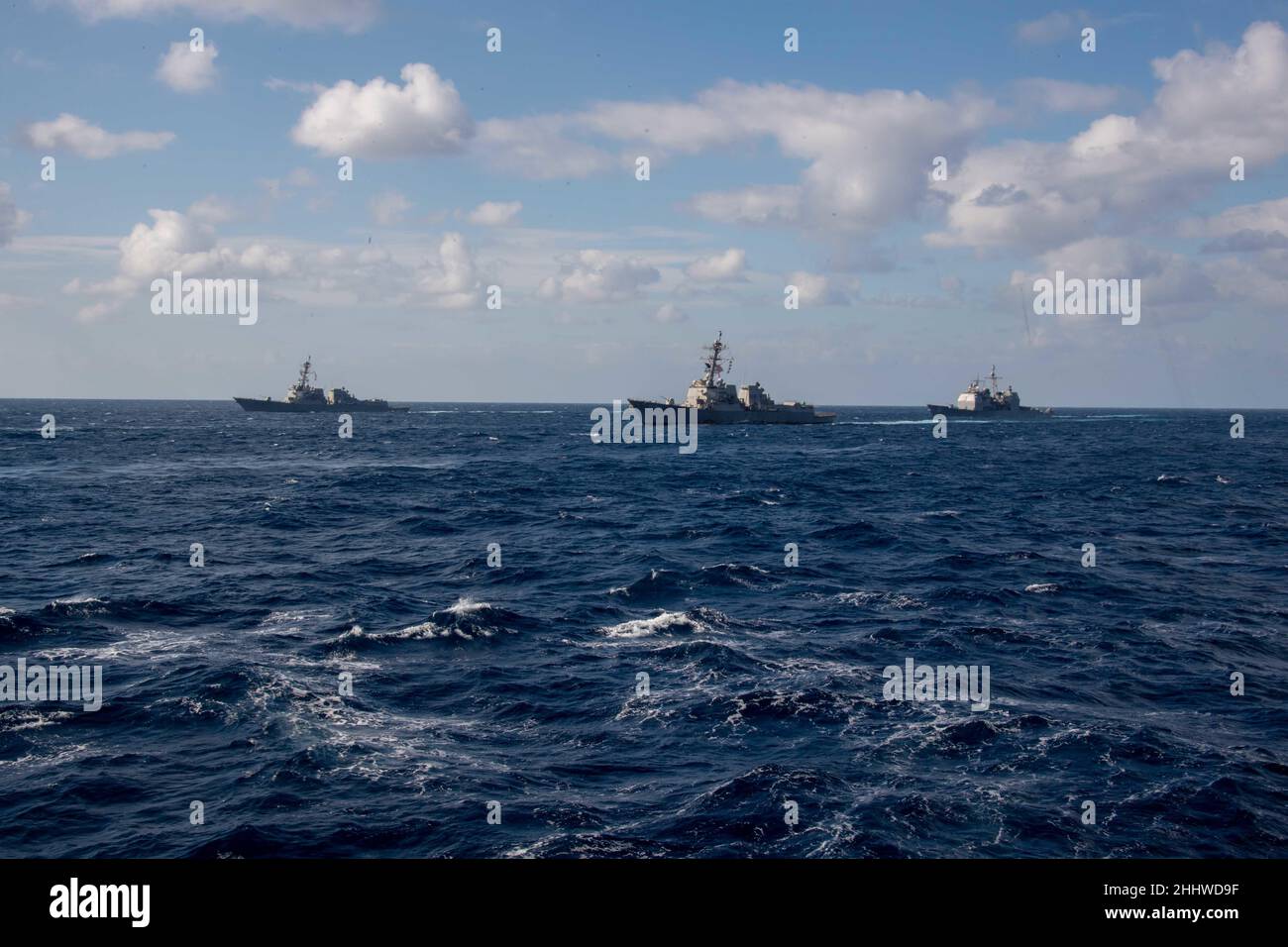 PHILIPPINE SEA (Jan. 22, 2022) From left to right, the Arleigh Burke ...