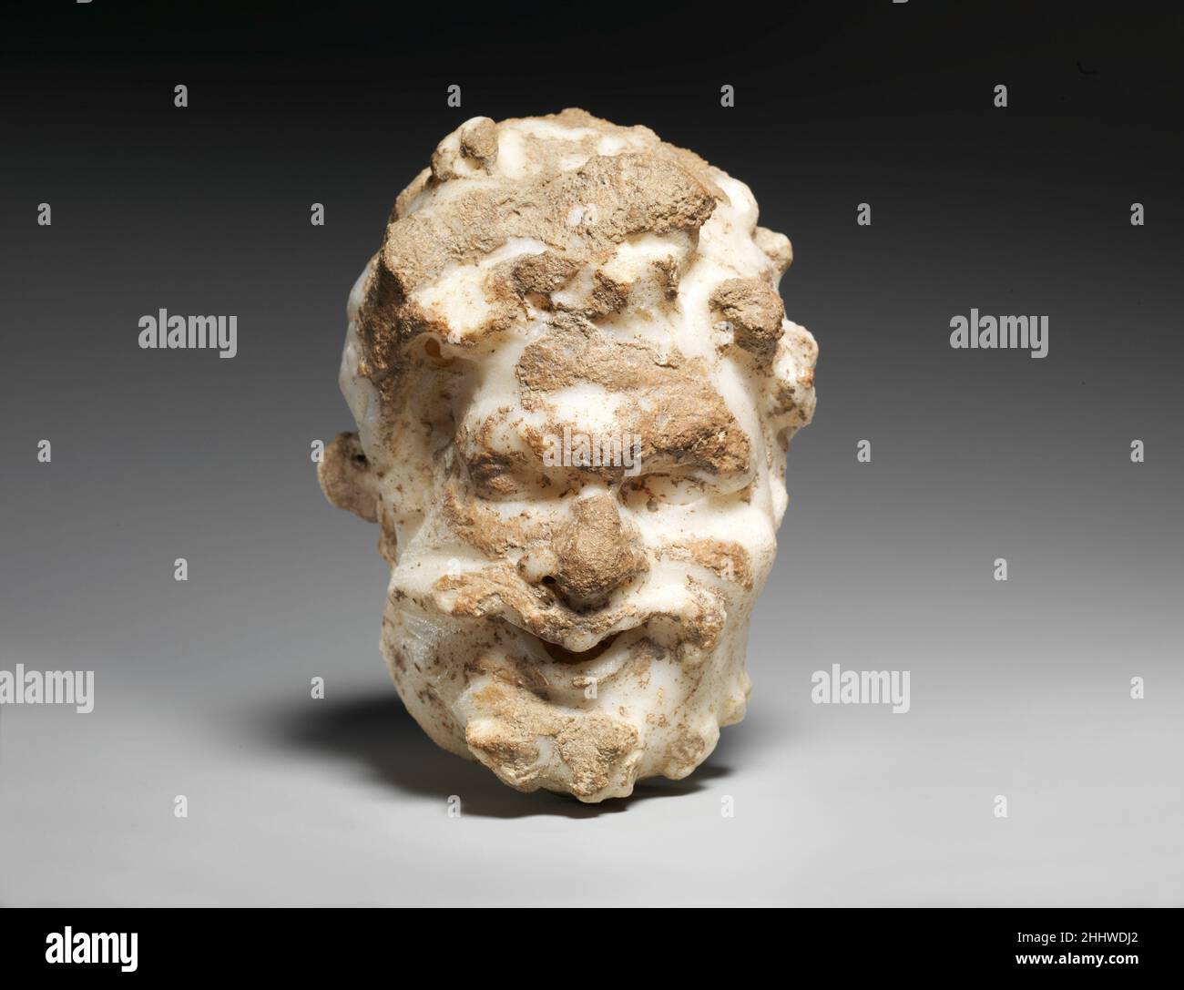 Marble head of a satyr 3rd–1st century B.C. Greek Small, encrusted head ...