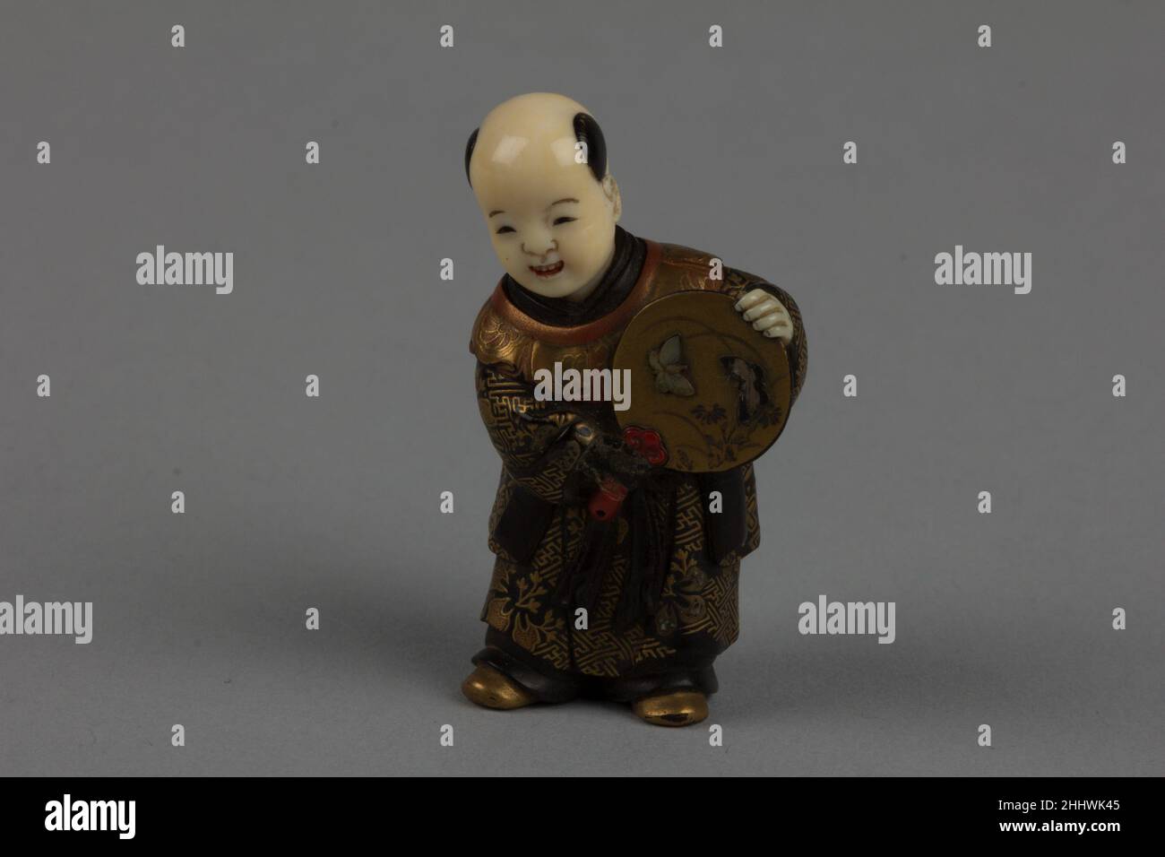 Netsuke of Boy with a Fan 19th century Japan. Netsuke of Boy with a Fan ...