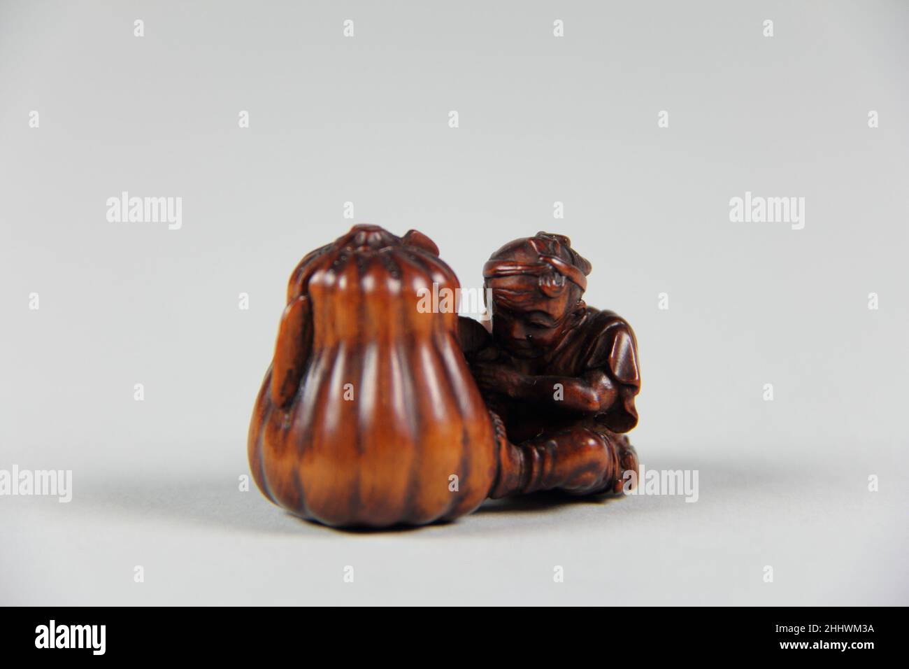 Netsuke of Boy Cutting a Gourd 19th century Japan. Netsuke of Boy ...