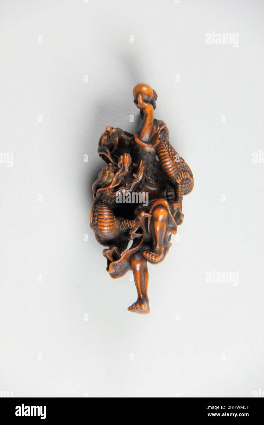 Netsuke of Dragon Coiled around the Body of a Man 19th century Japan ...