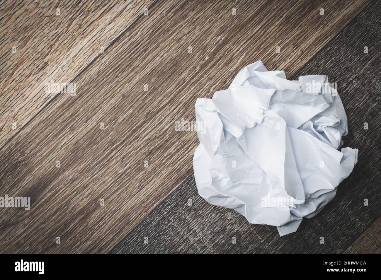 Crumpled and torn paper on the table. Torn piece of notebook. Paper ...