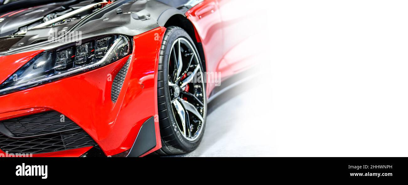 Close up Front headlights of red modify car white background Stock ...