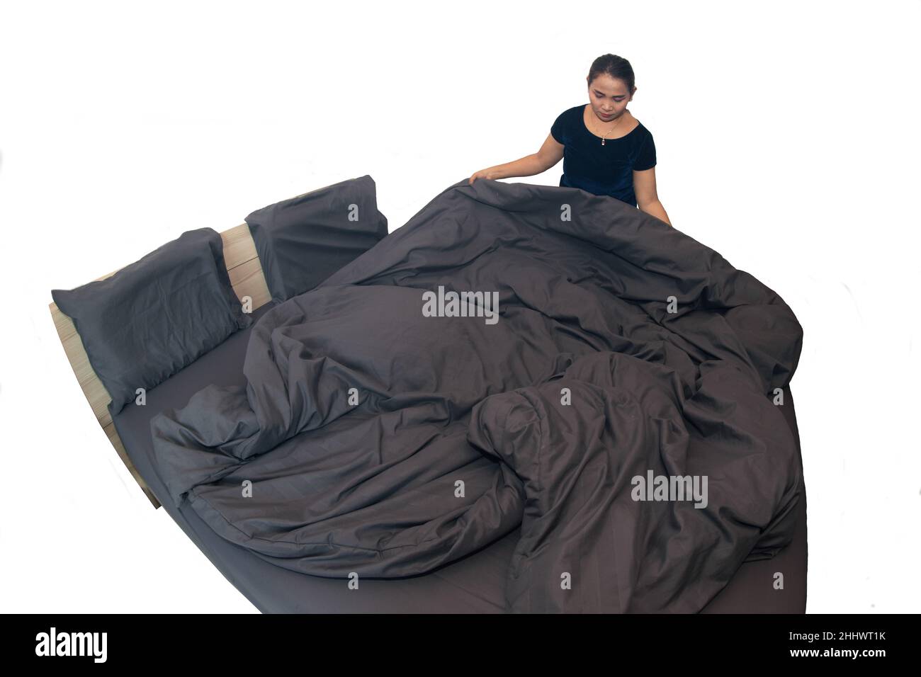 An Asian female maid making bed in hotel room. Housekeeper Making Bed ...