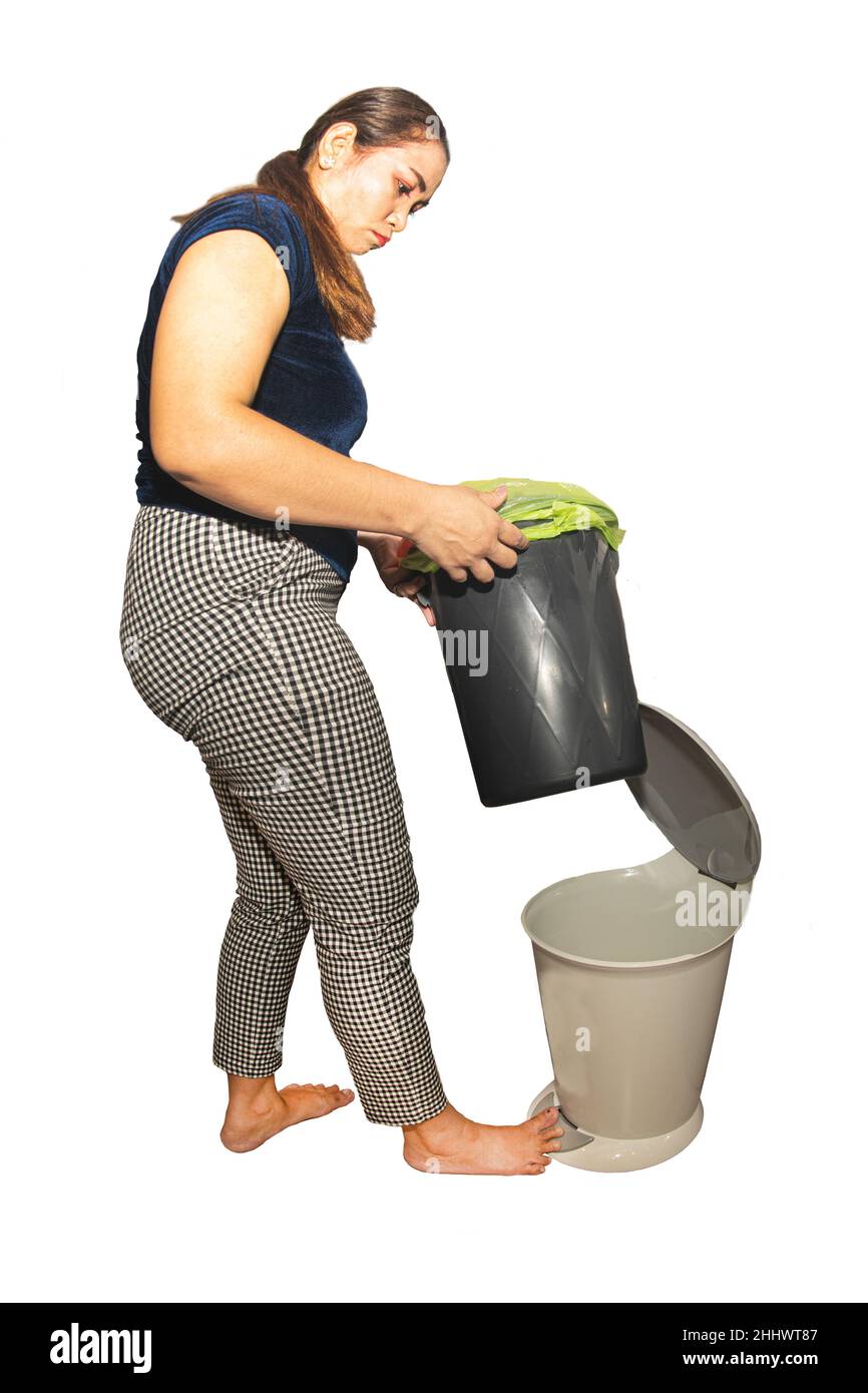 An Asian female maid is bringing plastic trash into the kitchen on ...