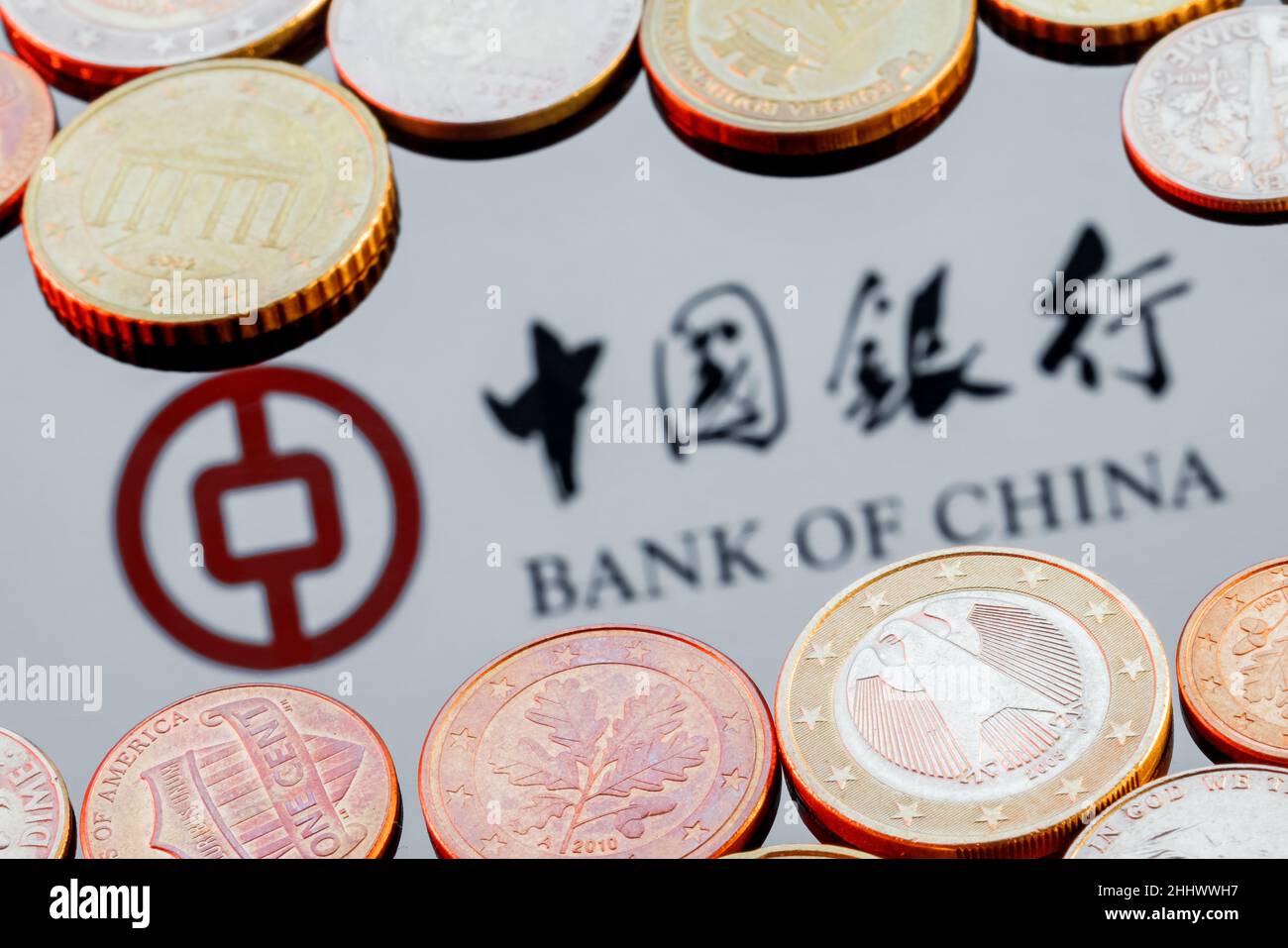 Variety of metal coins on background of Bank of China logo Stock Photo ...