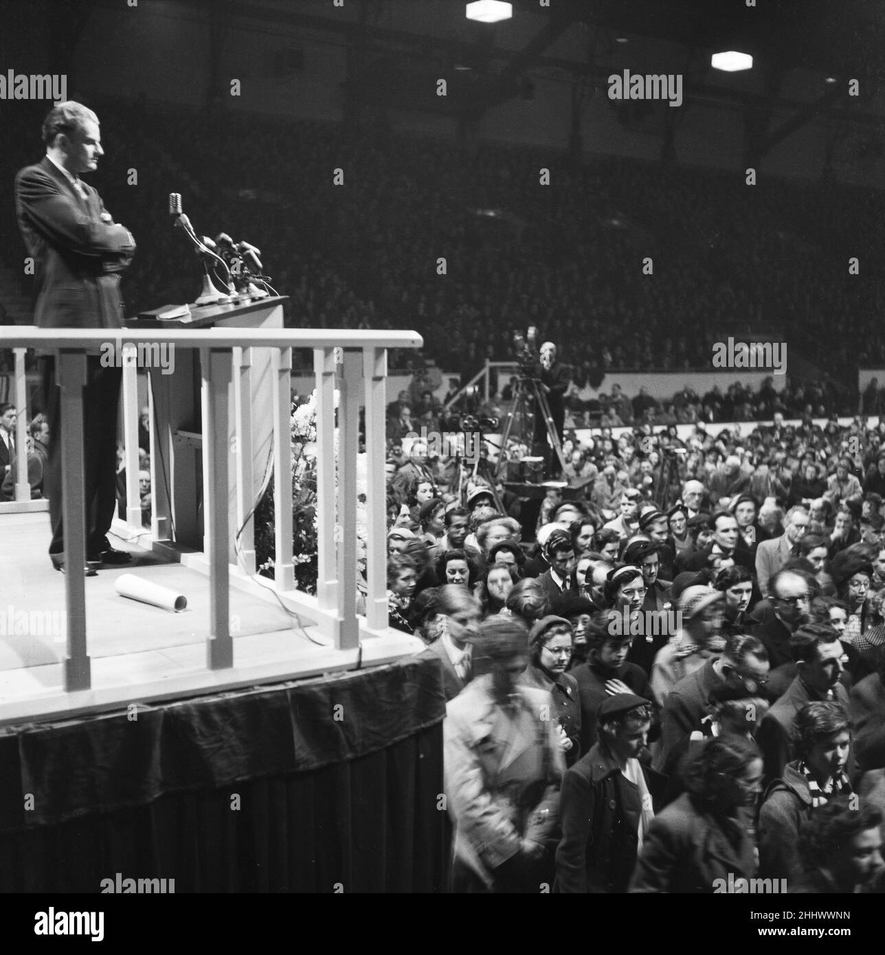 American evangelist Billy Graham speaks to the crowd at the Harringay ...