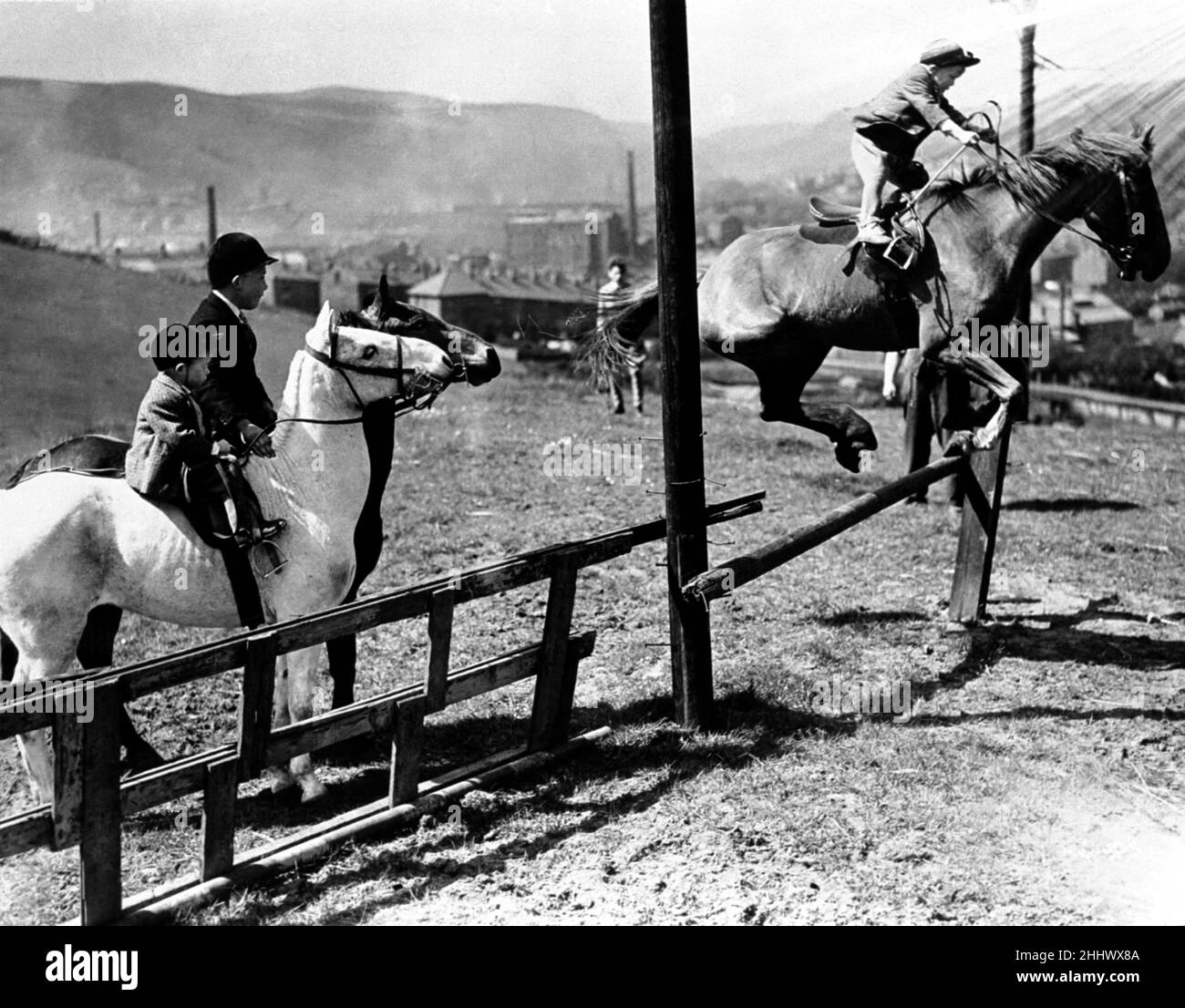Three very young boys: Peter, Tony, & Kaye, riding horses at their ...