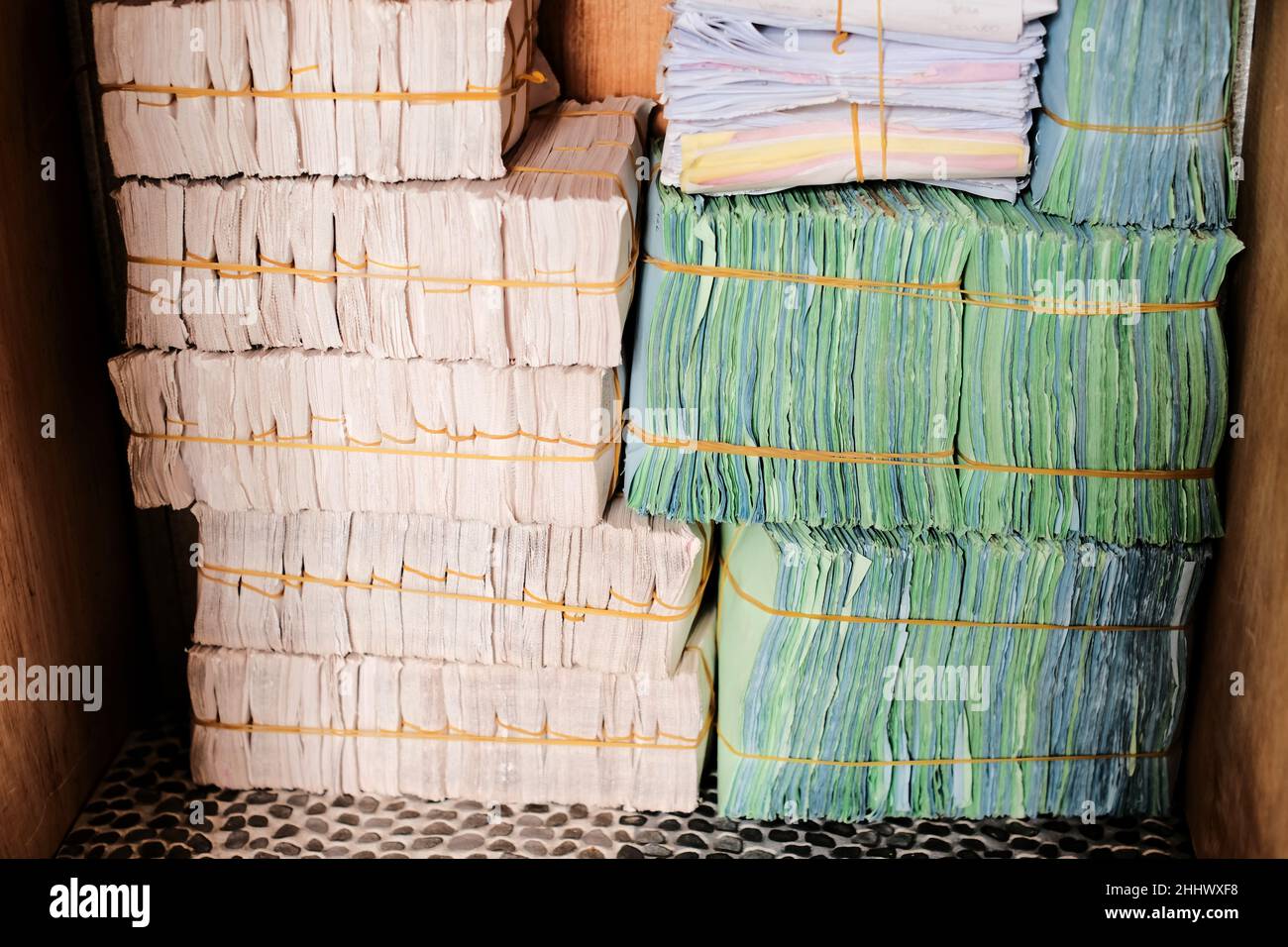 A pile of paper tied with used rubber notes Stock Photo - Alamy