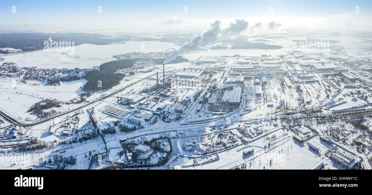 suburban industrial district in winter. factory buildings, warehouses ...