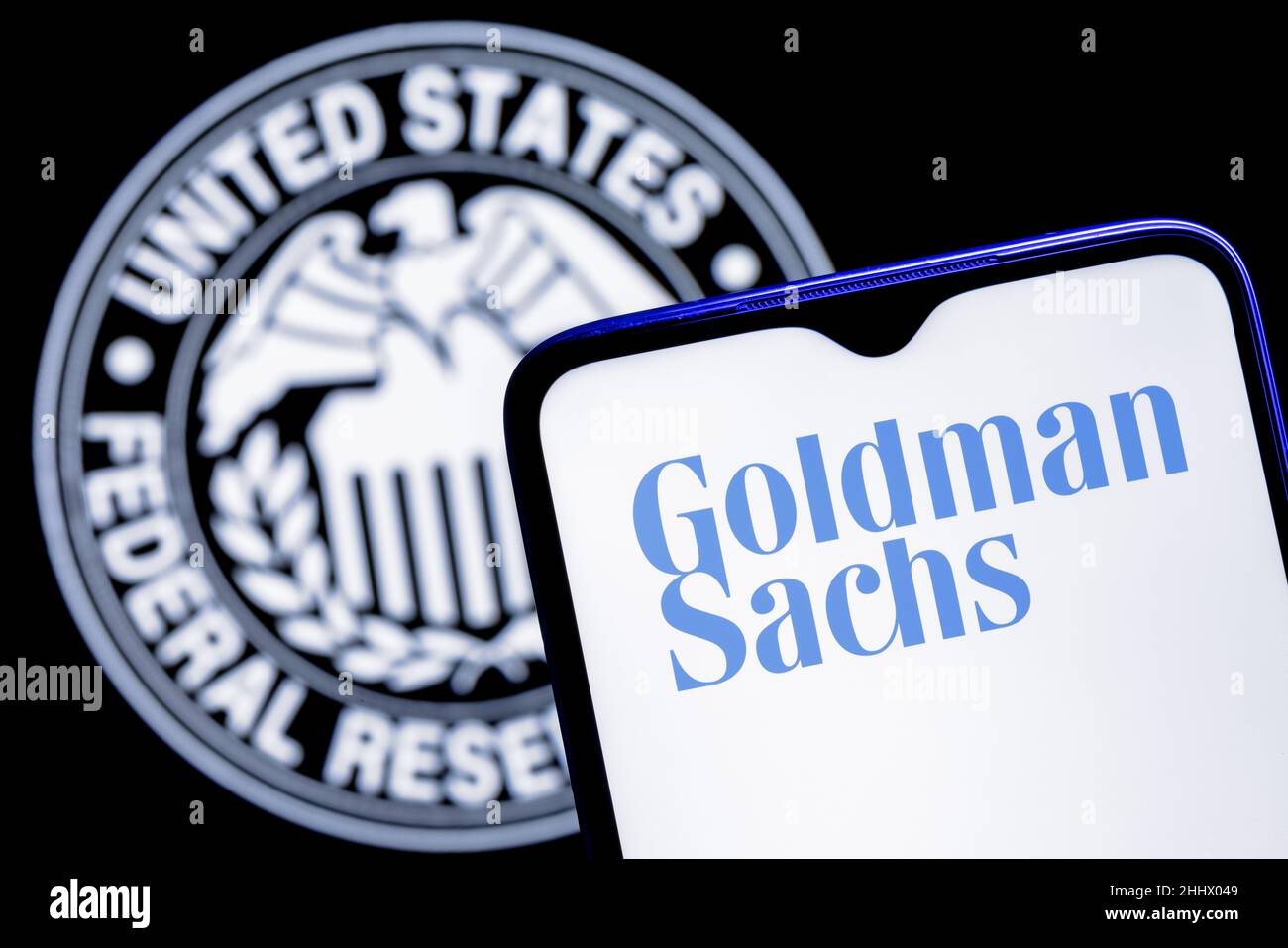 Smartphone with Goldman Sachs bank logo on background of Federal ...