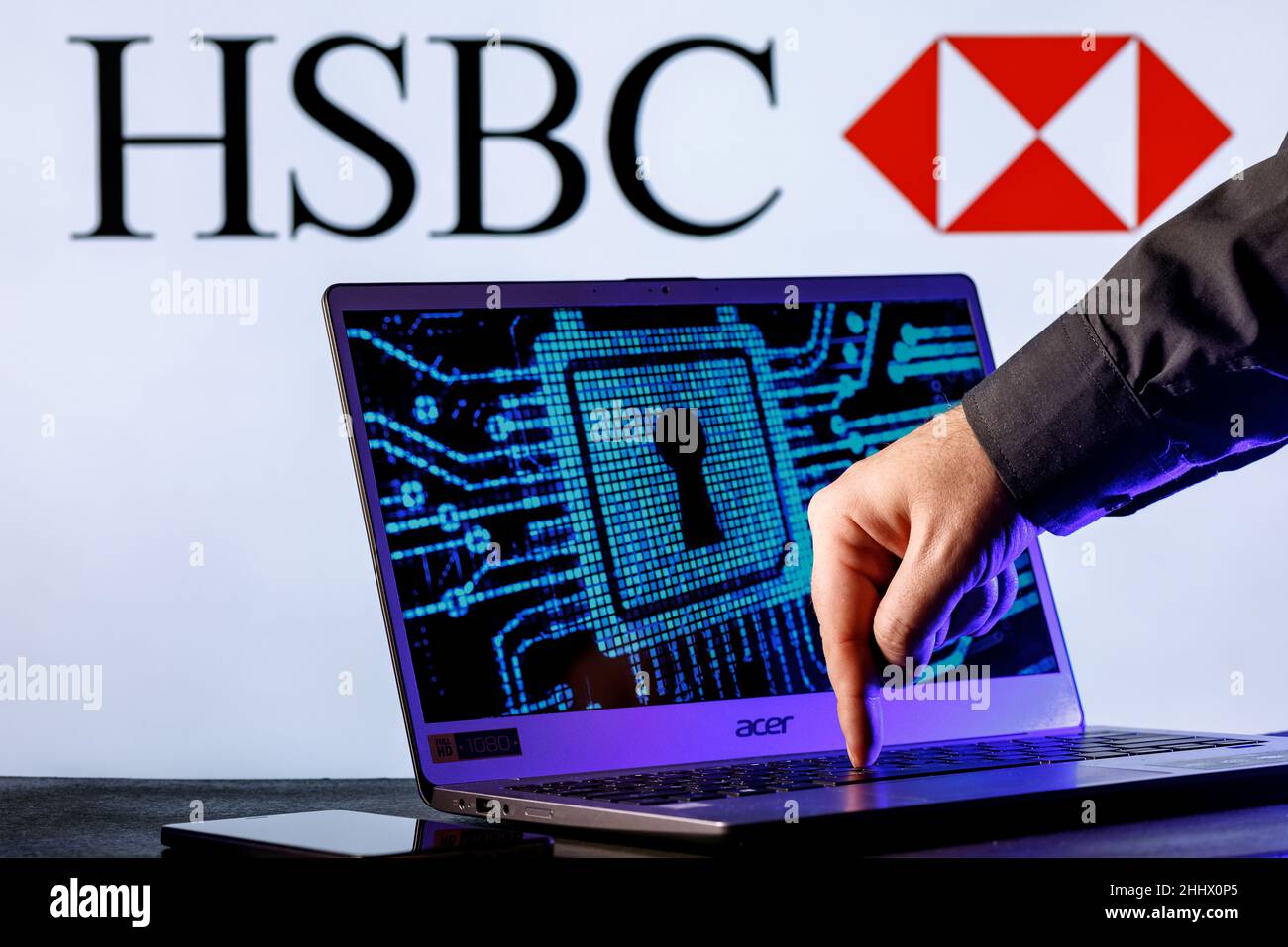 Laptop with lock symbol on screen on background of HSBC bank logo ...