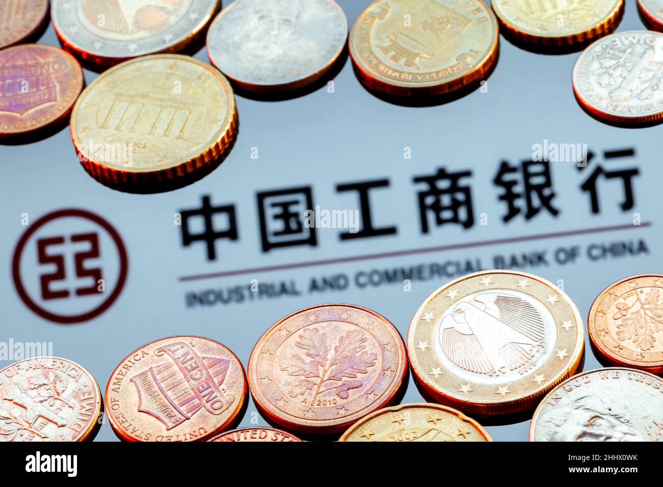 Variety of metal coins on background of Industrial and Commercial Bank ...