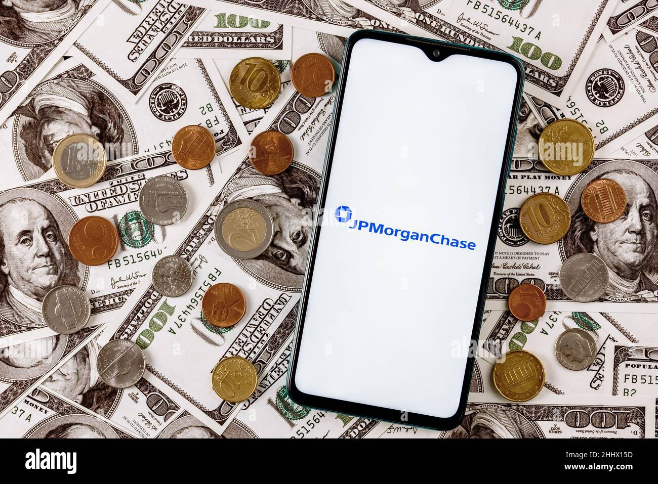 Smartphone with JPMorgan Chase bank logo surrounded by variety of metal ...