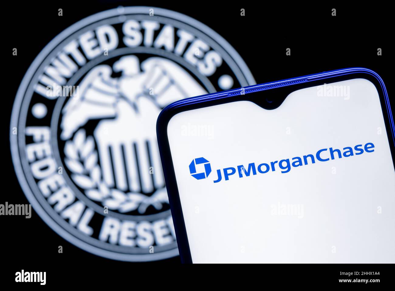 Smartphone with JPMorgan Chase bank logo on background of Federal ...