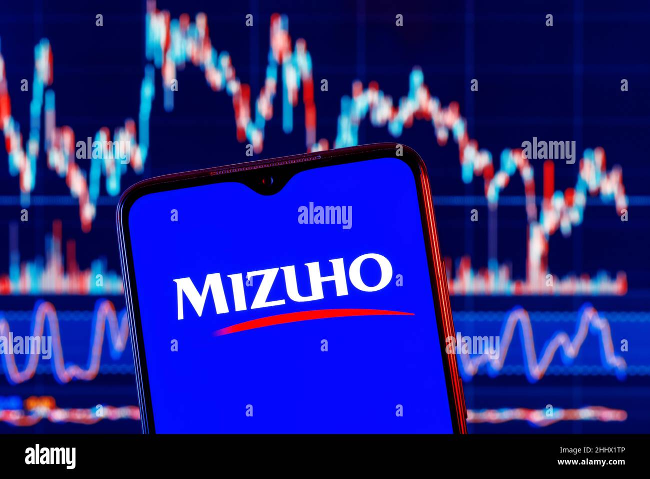 Smartphone with Mizuho Financial Group logo. Mizuho stock chart on the ...