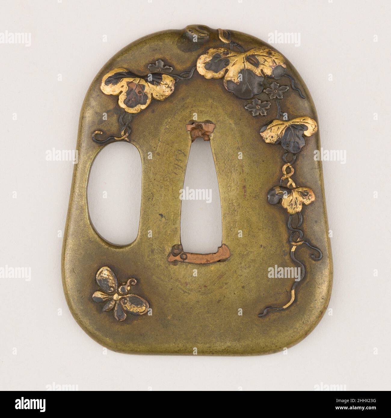 Sword guard (Tsuba) With the Motif of Paulownia Leaves, Tendrils, and ...