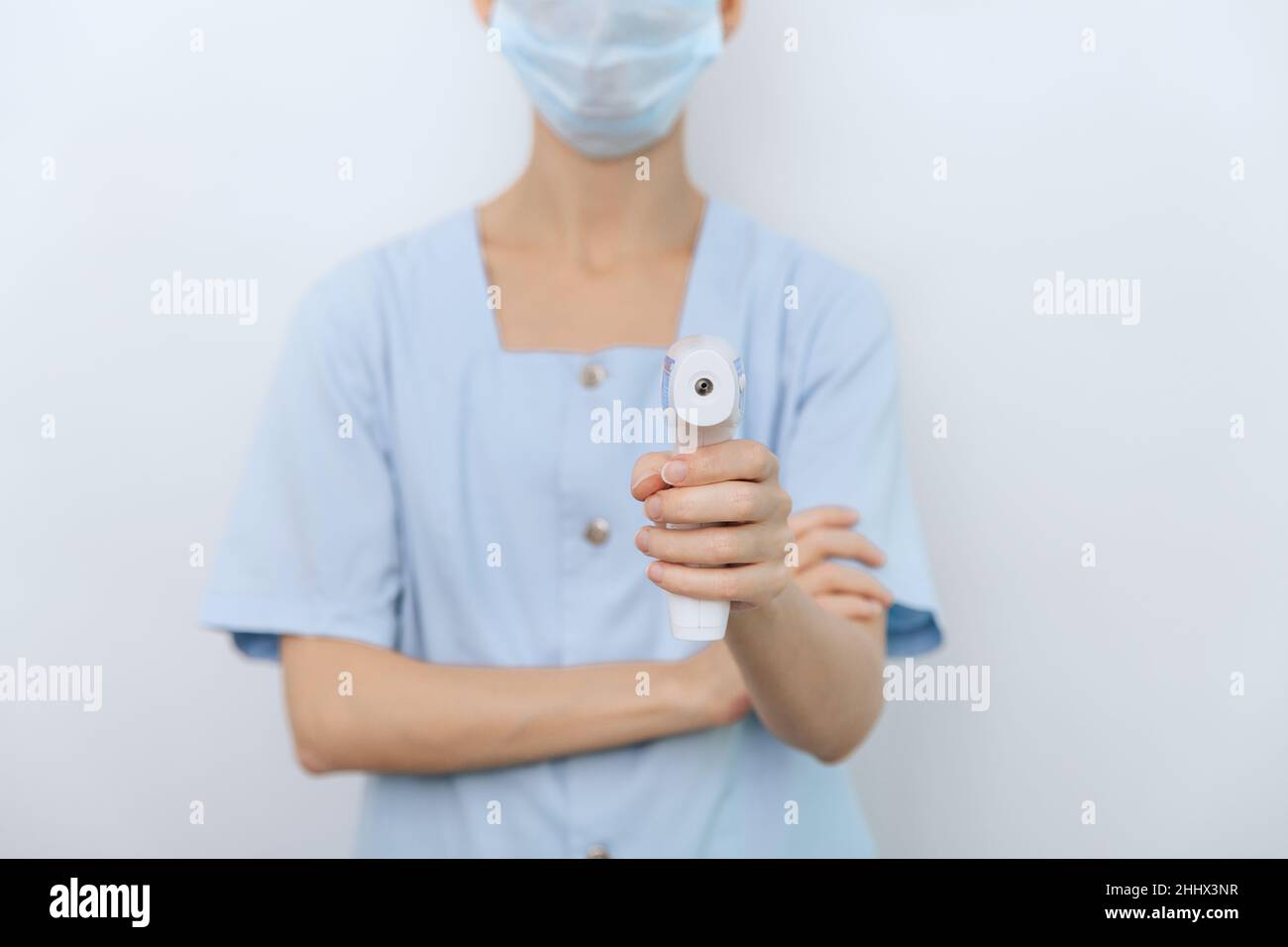 Temperature measurement gun in doctor hands. Close-up shot of doctor ...