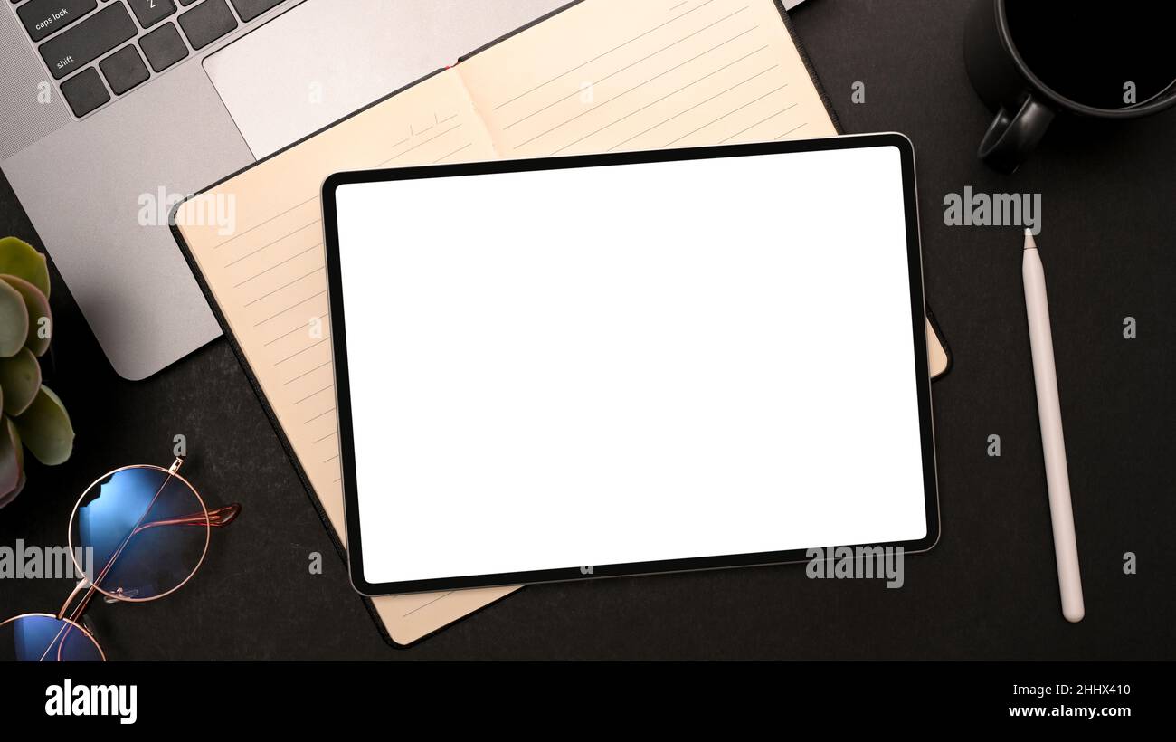 Flat lay, Digital tablet computer blank screen mockup on modern dark ...