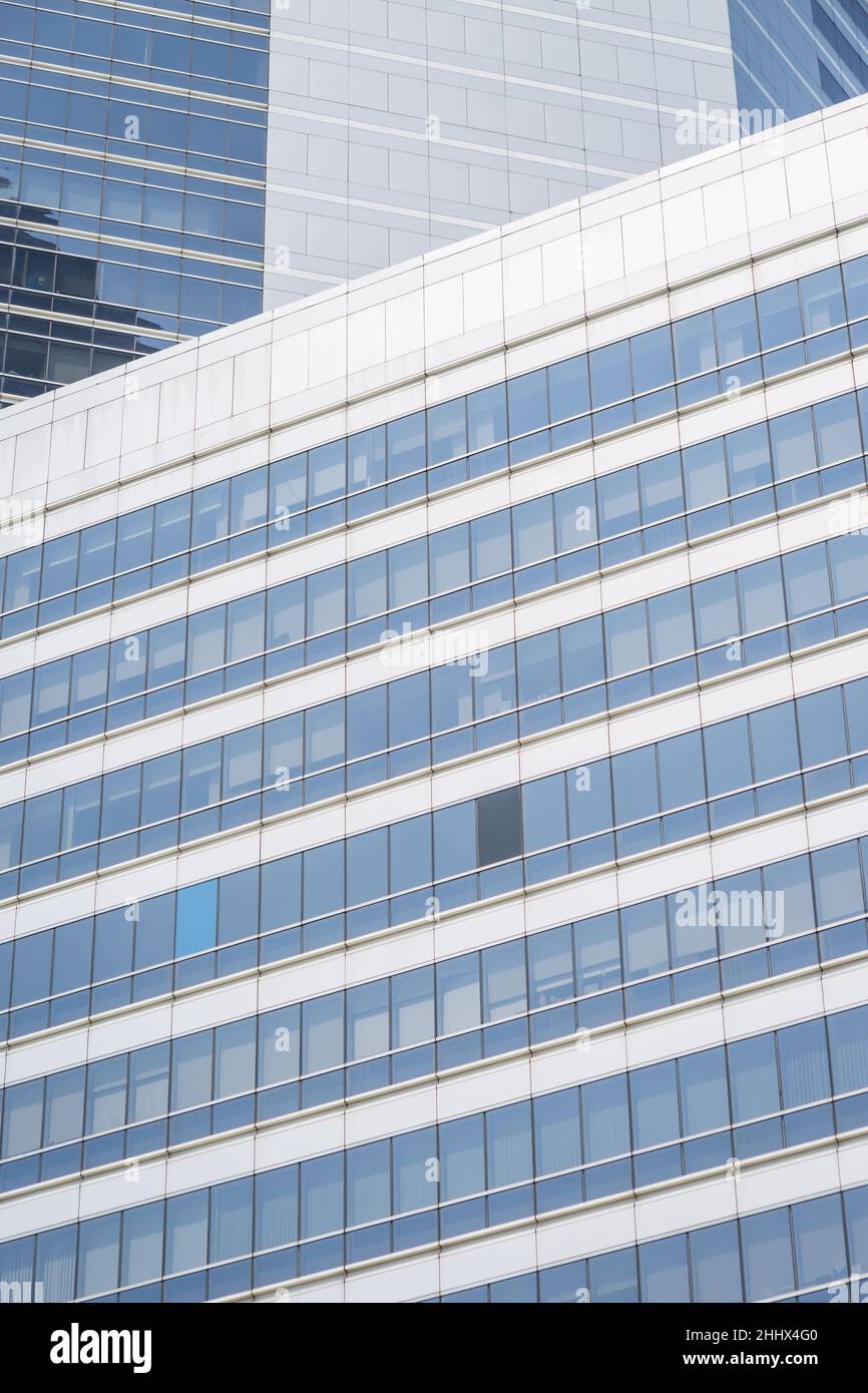 Modern office building with blue glass windows background Stock Photo ...
